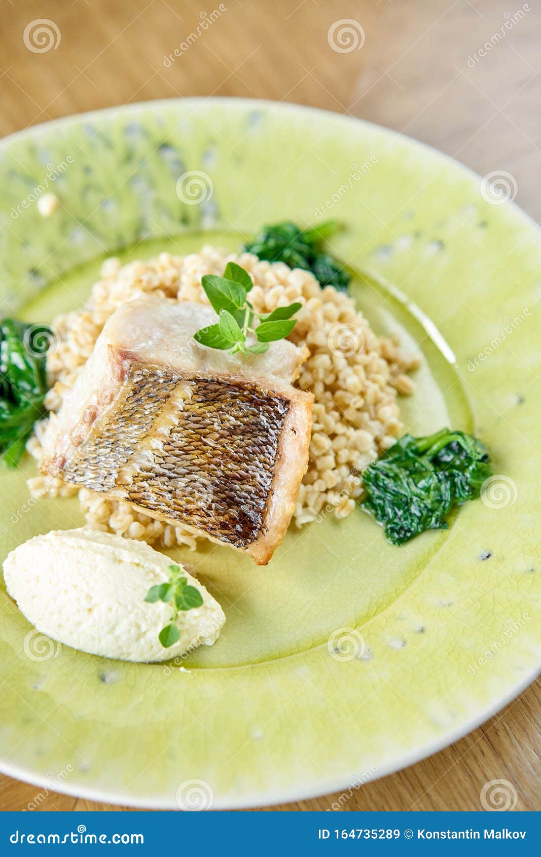 Roasted Pike Perch or Cod Fish with Bulgur. Dish Decorated with a ...