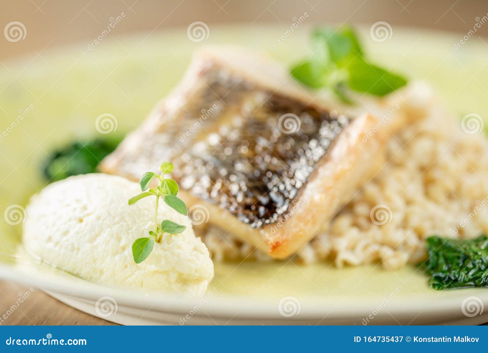 Roasted Pike Perch or Cod Fish with Bulgur. Dish Decorated with a ...