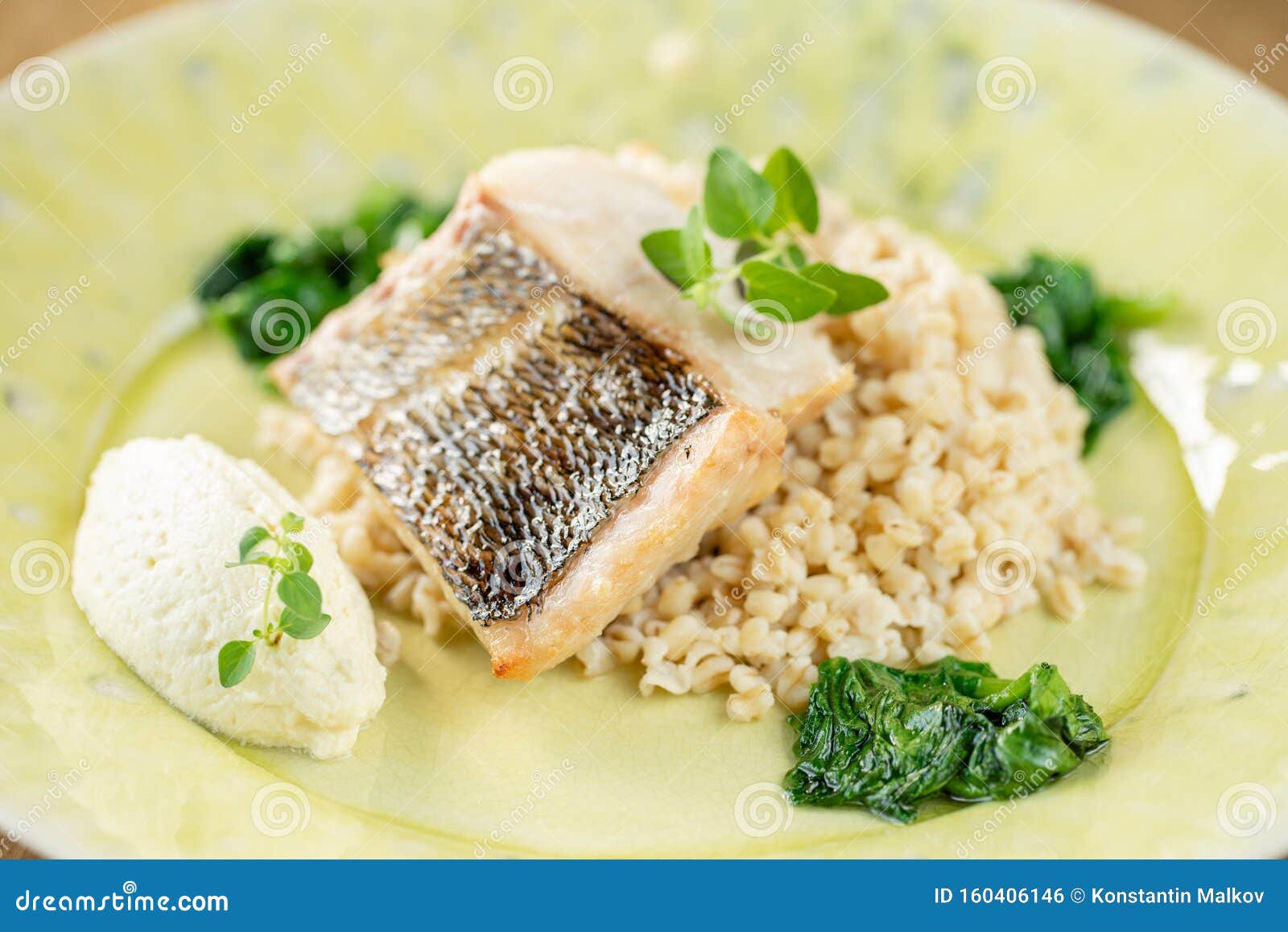 Roasted Pike Perch or Cod Fish with Bulgur. Dish Decorated with a ...