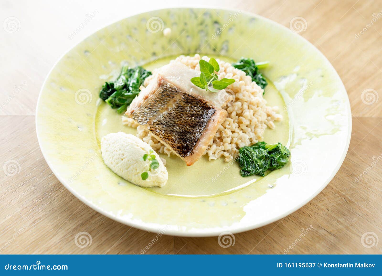 Roasted Pike Perch with Spelt and Polish Sauce. Dish Decorated with a ...