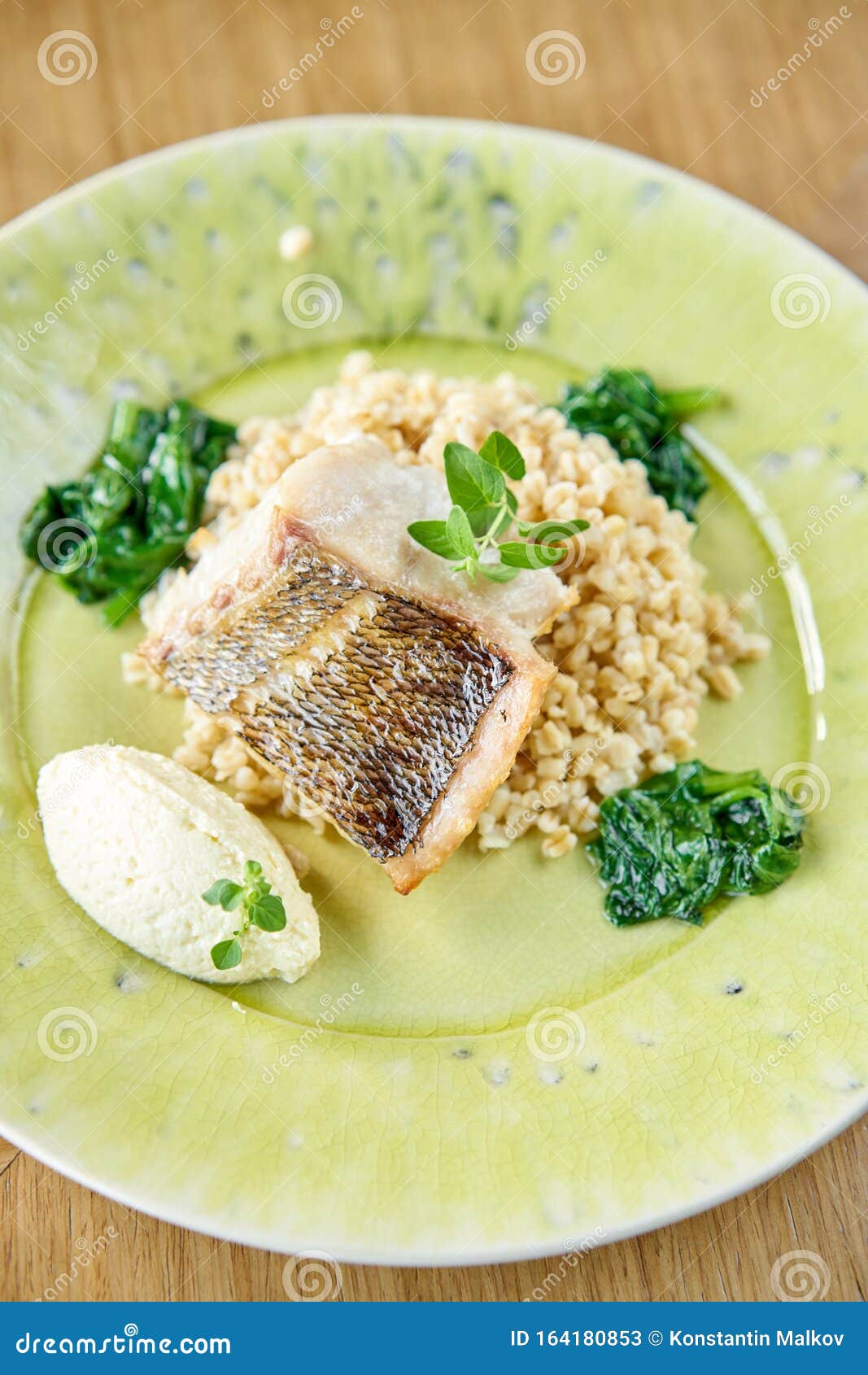 Roasted Pike Perch with Spelt and Polish Sauce. Dish Decorated with a ...