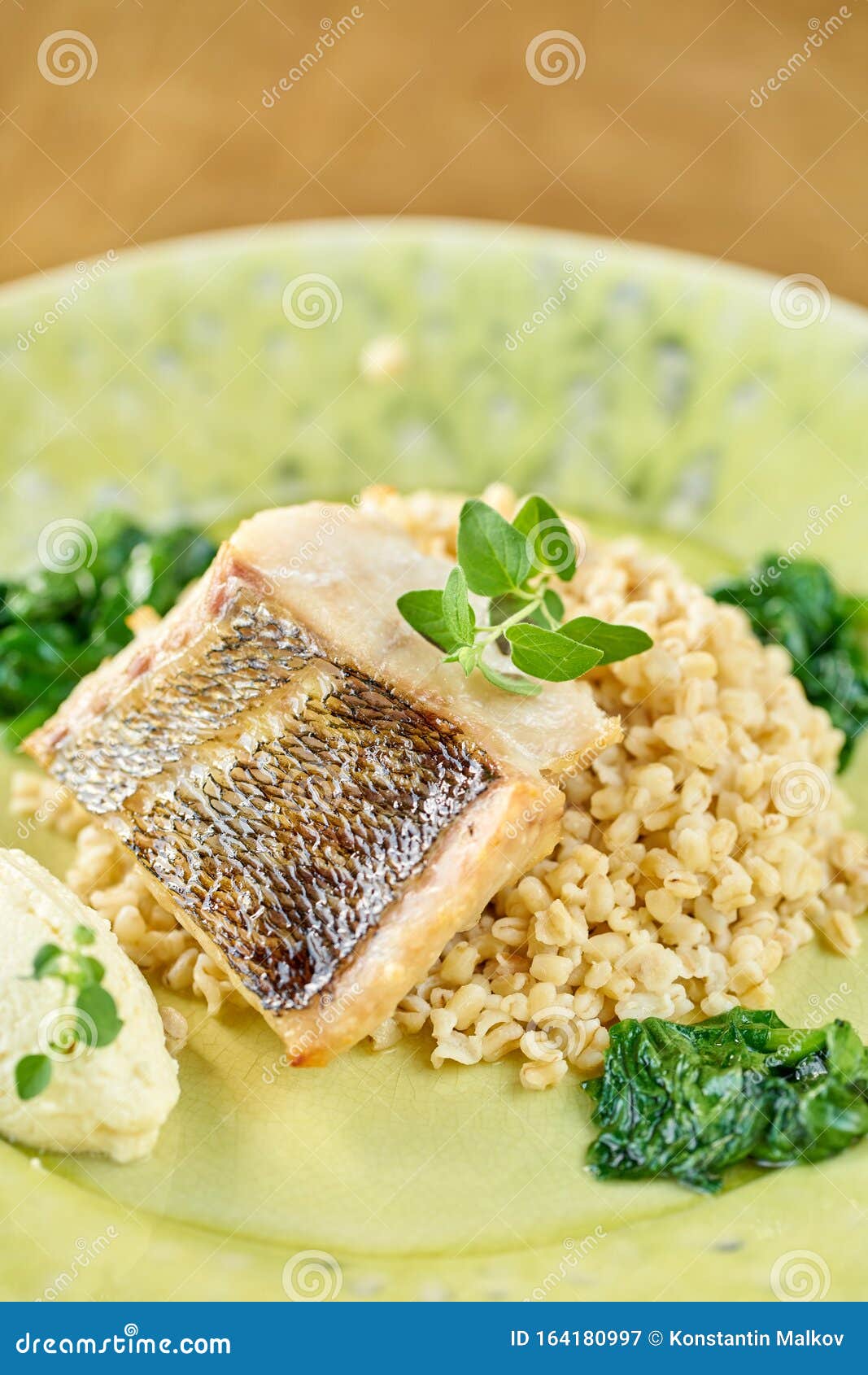 Roasted Pike Perch with Spelt and Polish Sauce. Dish Decorated with a ...