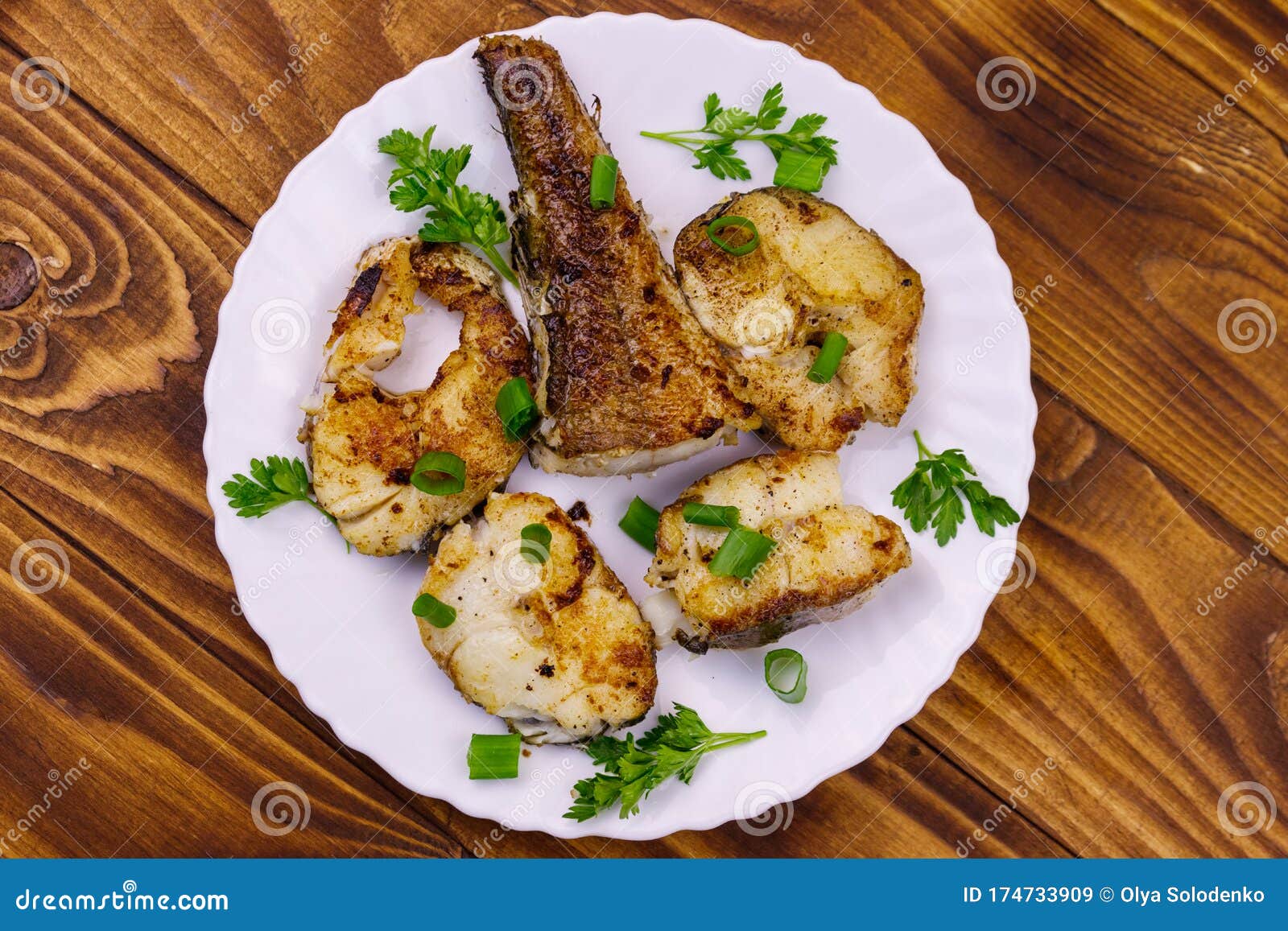 Roasted Pollock in White Plate on Wooden Table Stock Image - Image of ...