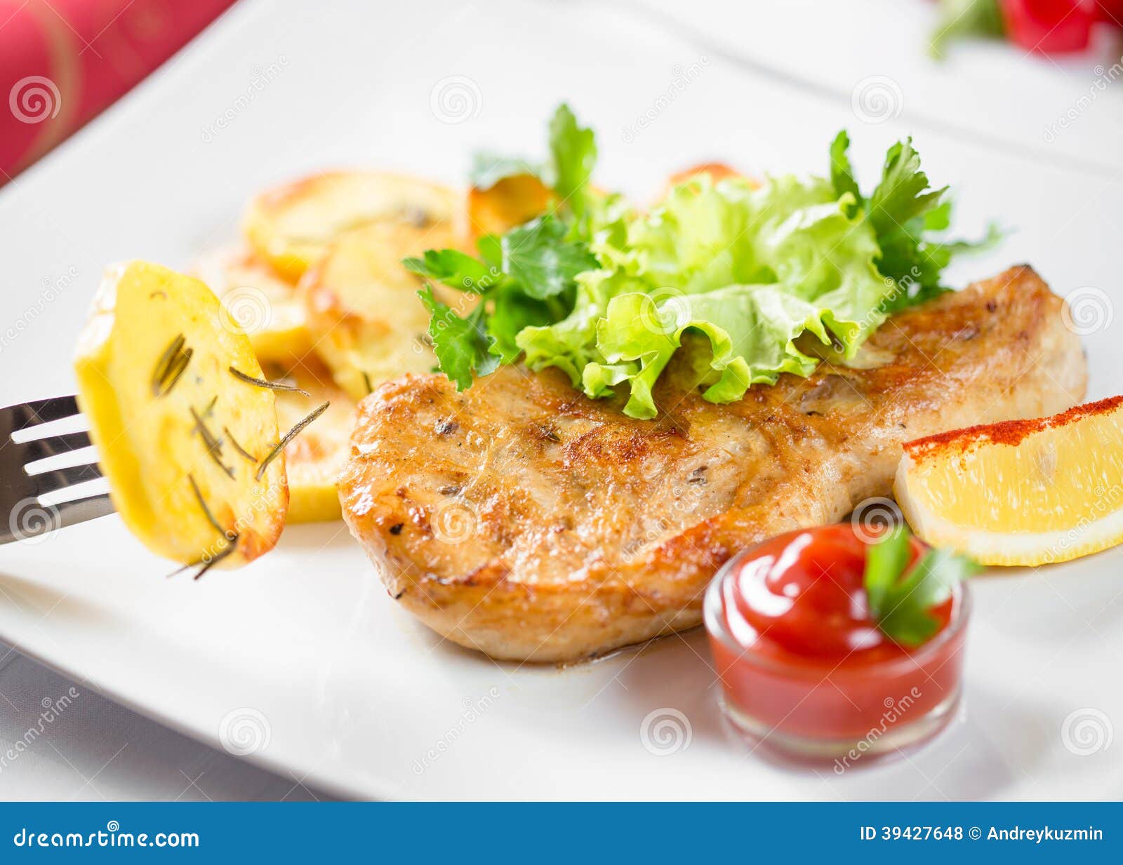 Roasted Pork Chop with Potatoes, Ketchup and Lemon Stock Photo - Image ...