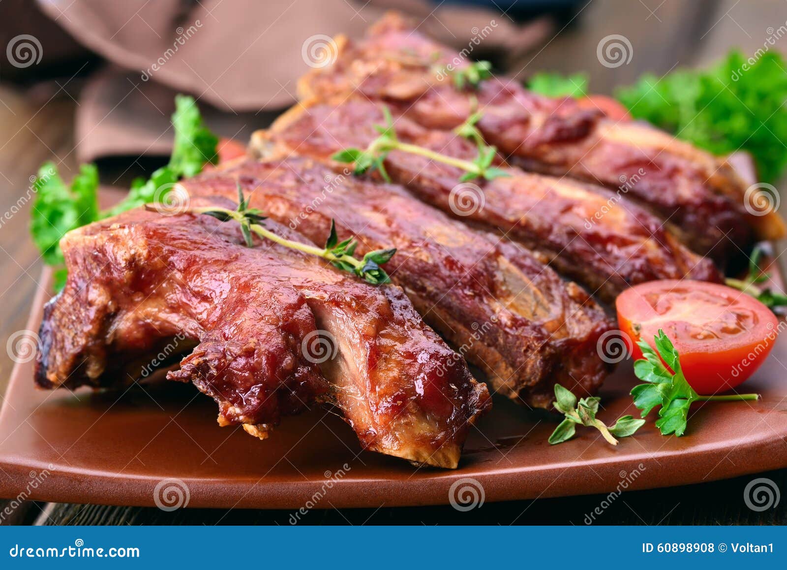 Roasted pork ribs on plate stock photo. Image of roasted - 60898908
