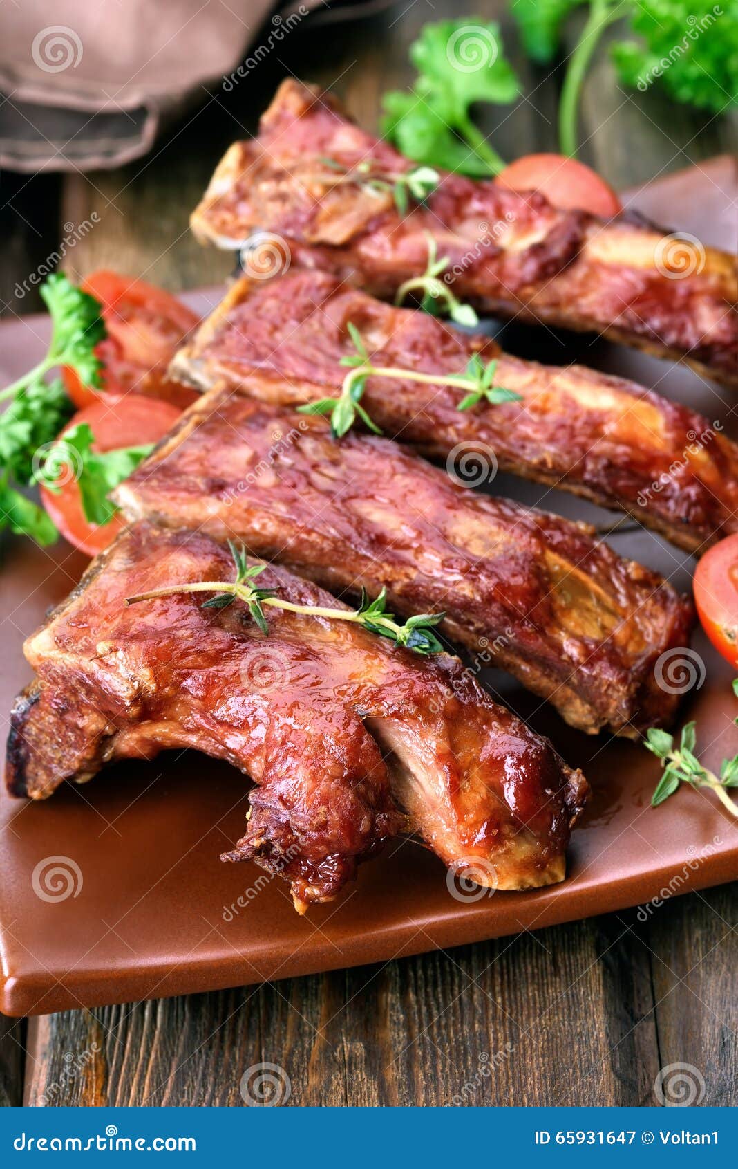Roasted pork ribs on plate stock image. Image of green - 65931647
