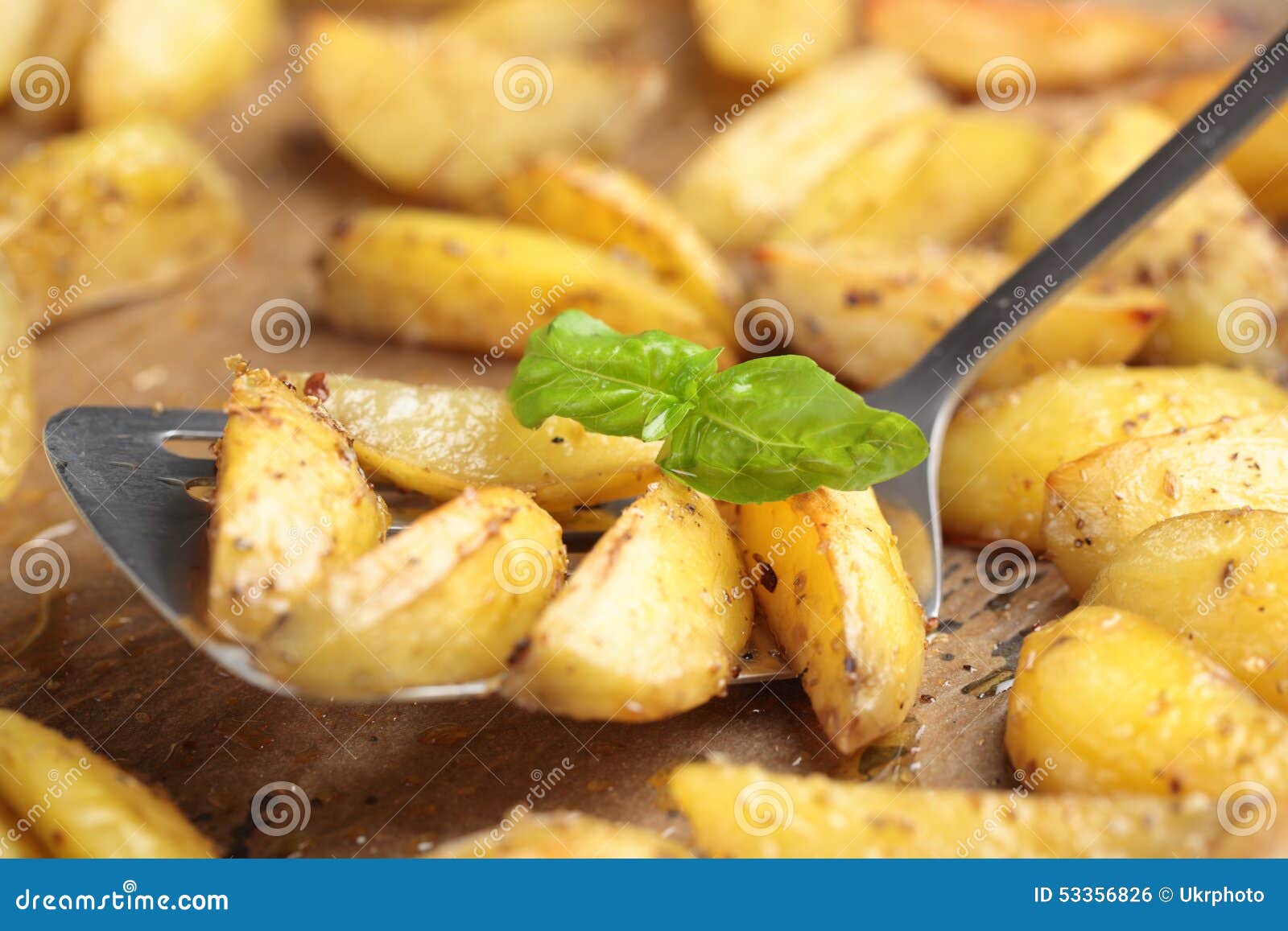 Roasted potato and basil stock photo. Image of sheet - 53356826