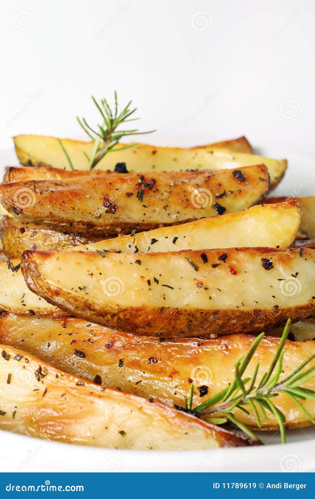 Roasted potatoes vertical stock image. Image of quartered - 11789619