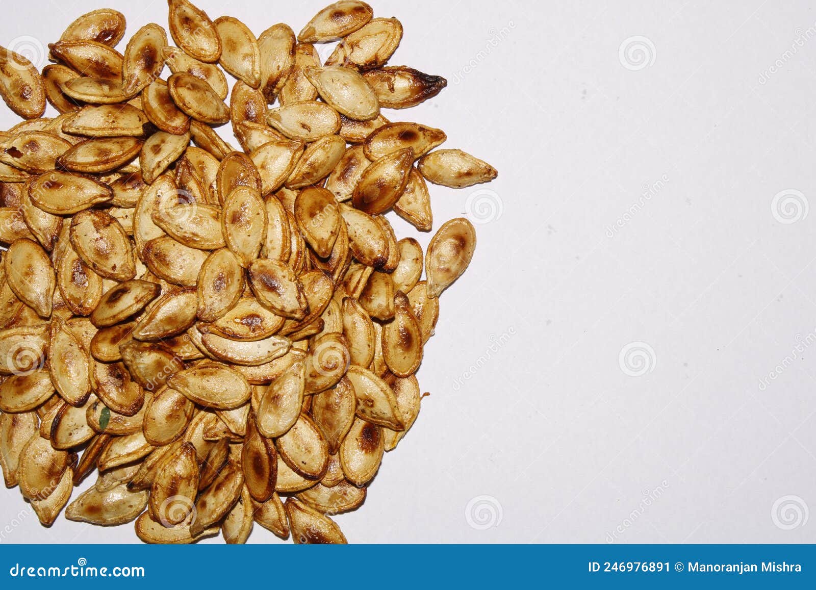 Roasted Pumpkin Seeds on White Background, Copy Space Stock Image ...