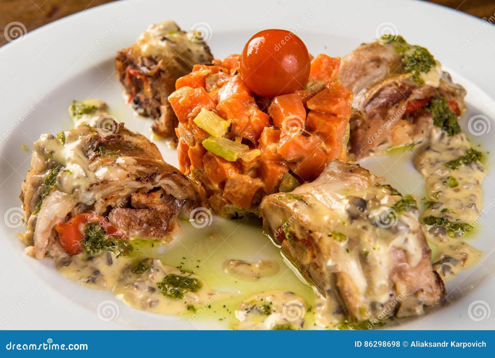 Roasted Rabbit Roulade with Carrot and Tomato Stock Photo - Image of ...