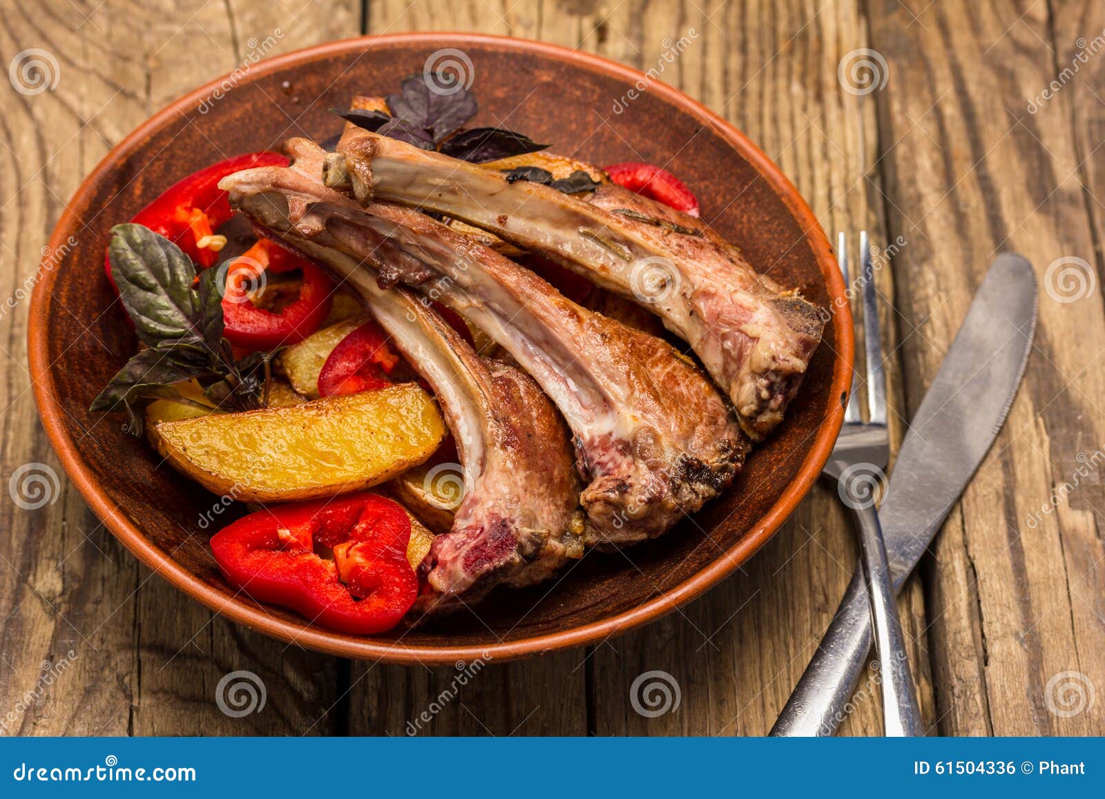 Roasted ribs of lamb stock photo. Image of food, silverware - 61504336