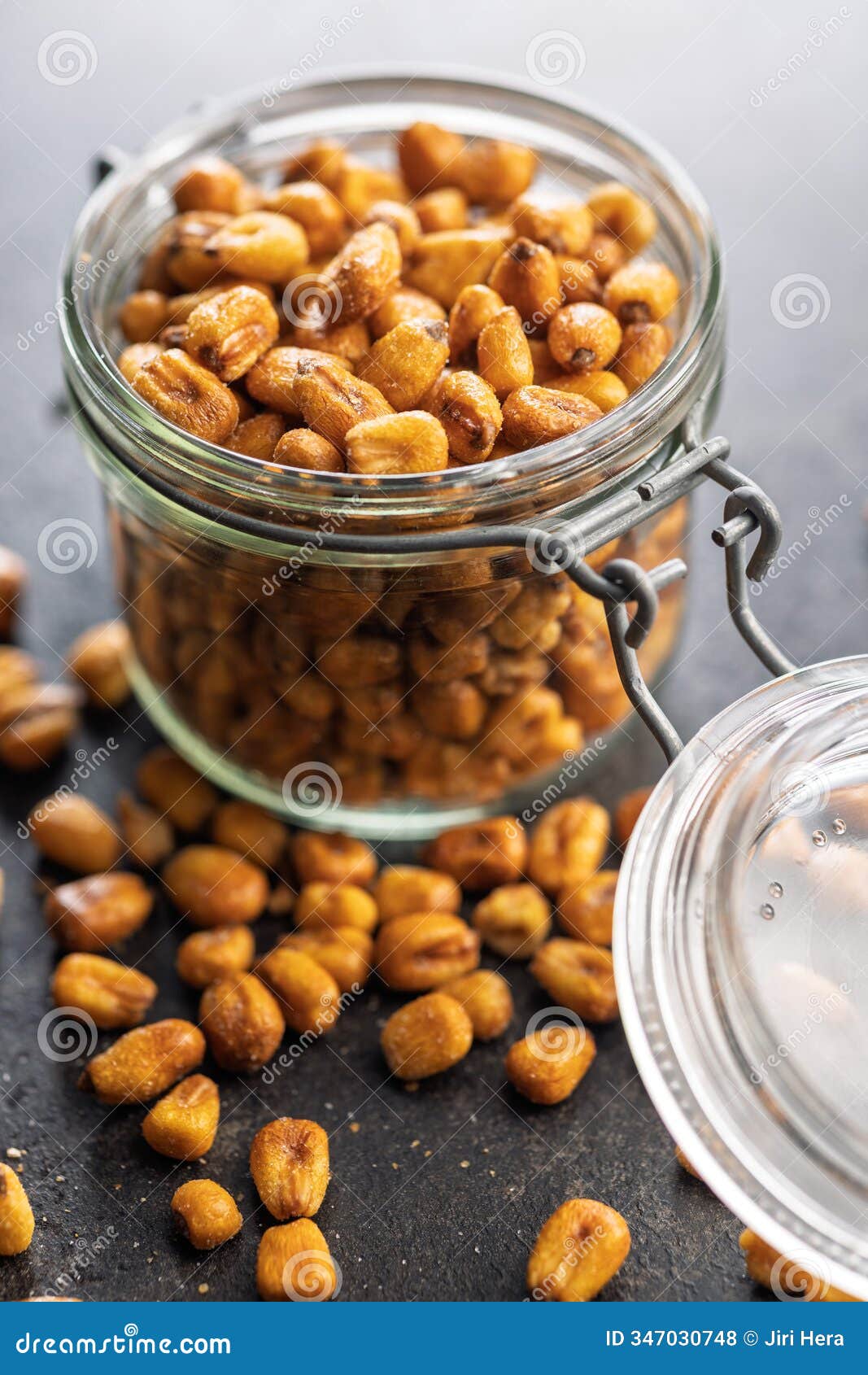 Roasted Salted Corn Snack in Jar on Black Table Stock Photo - Image of ...