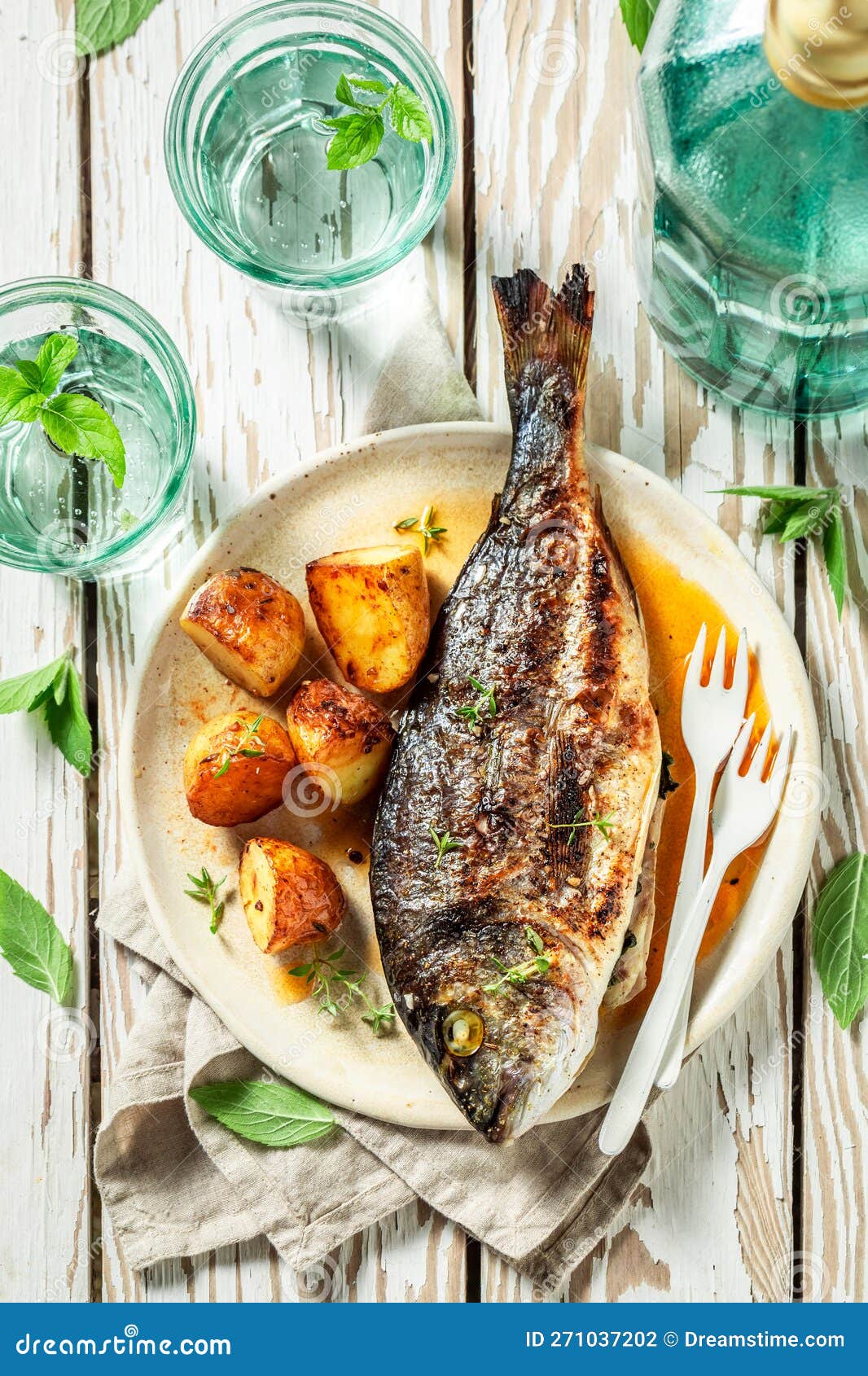 Roasted Sea Bream with Cherry Tomatoes and Grilled Potatoes Stock Photo ...
