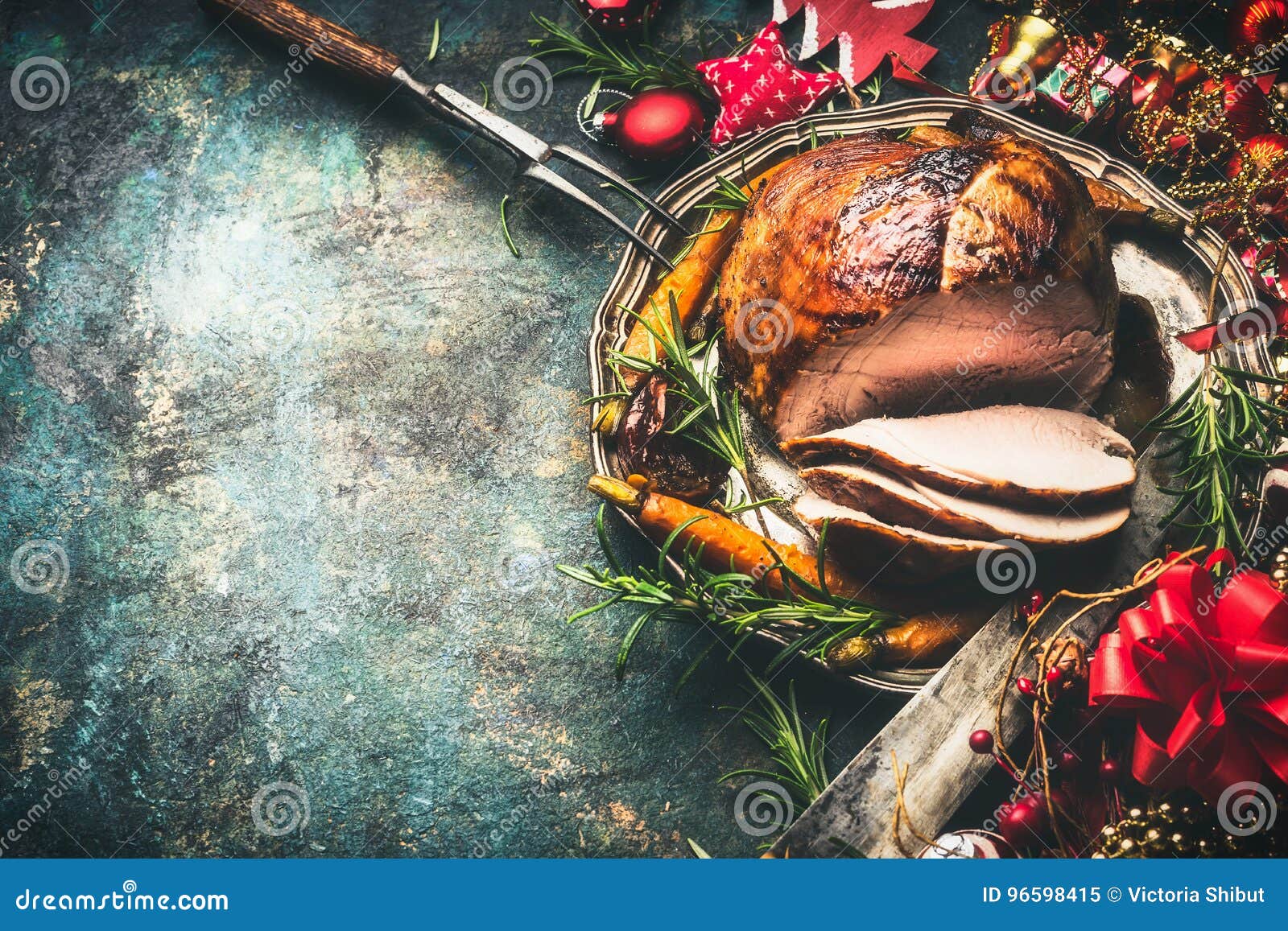 Roasted Sliced Christmas Ham on Festive Table Background with ...