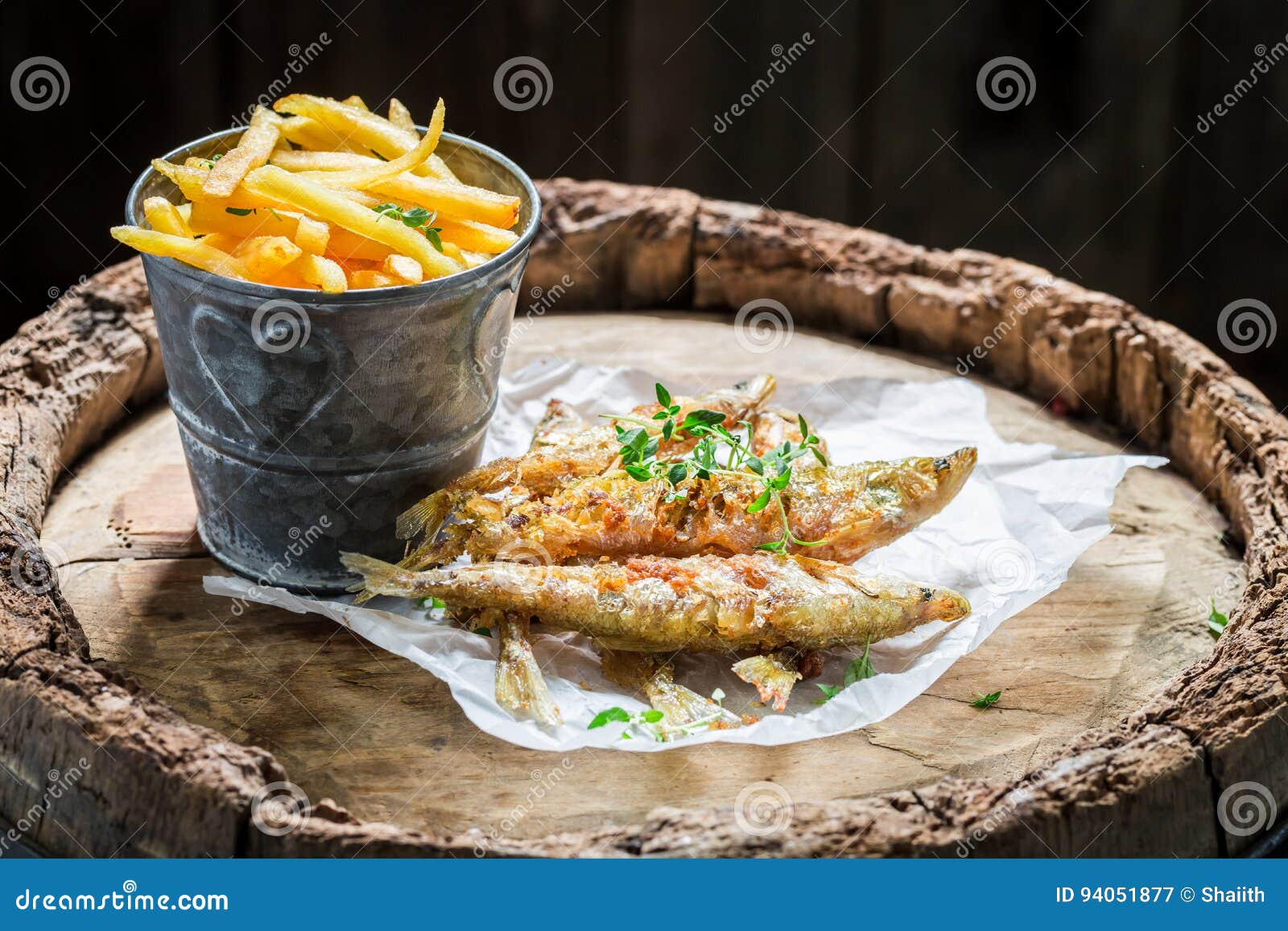 Roasted Smelt Fish with Herbs and Salt on Old Barrel Stock Image ...