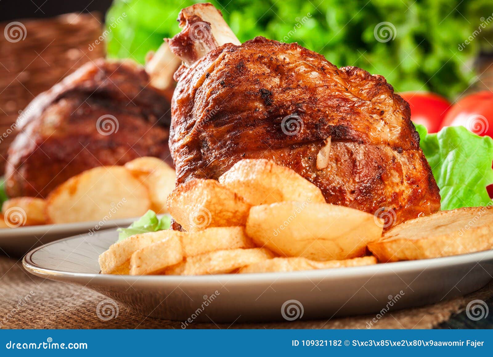 Roasted Turkey Knuckle with Fried Potato Slices Stock Photo - Image of ...