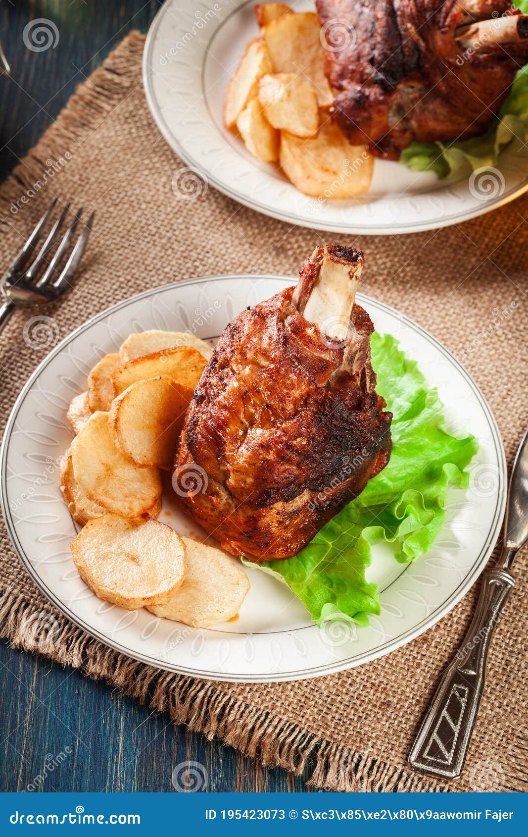 Roasted Turkey Knuckle with Fried Potato Slices Stock Image - Image of ...