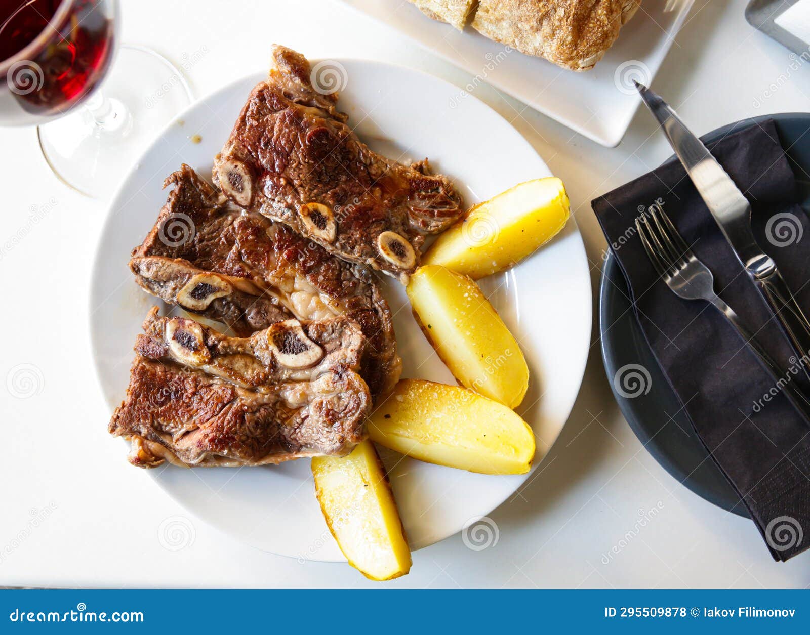 Roasted Veal Ribs with Potato Stock Photo - Image of portion, food ...
