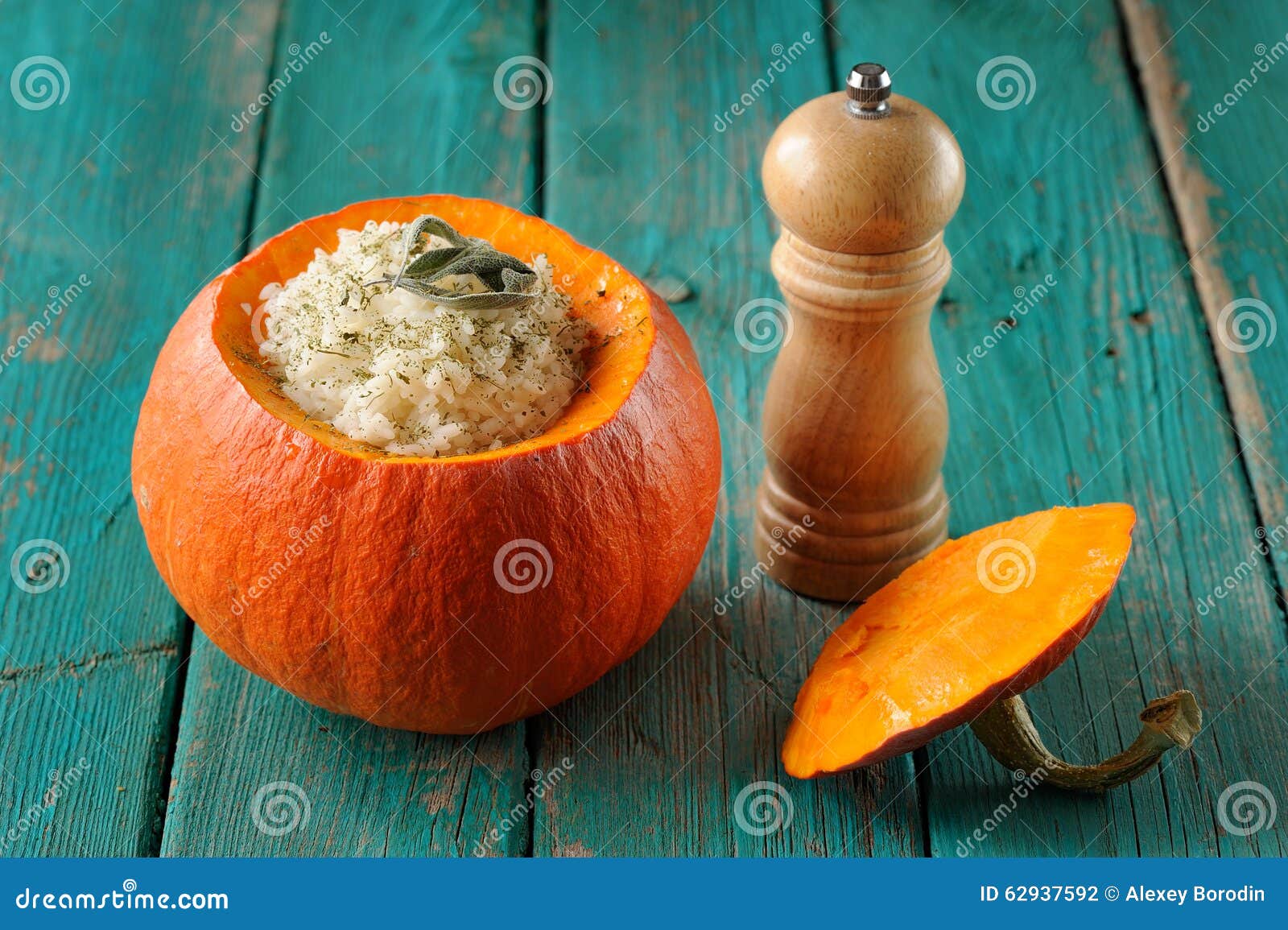 Roasted Whole Pumpkin with Rice and Meat with Pepper Mill Stock Photo ...