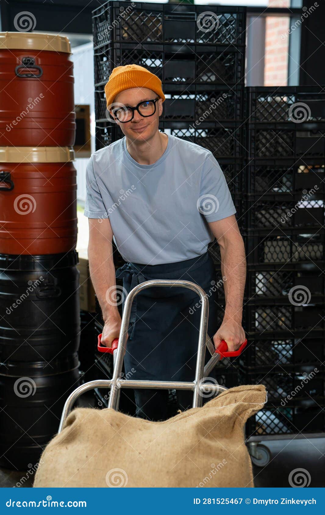 Roastery Worker Standing with Sacks with Coffee Beans Uploading. Stock ...