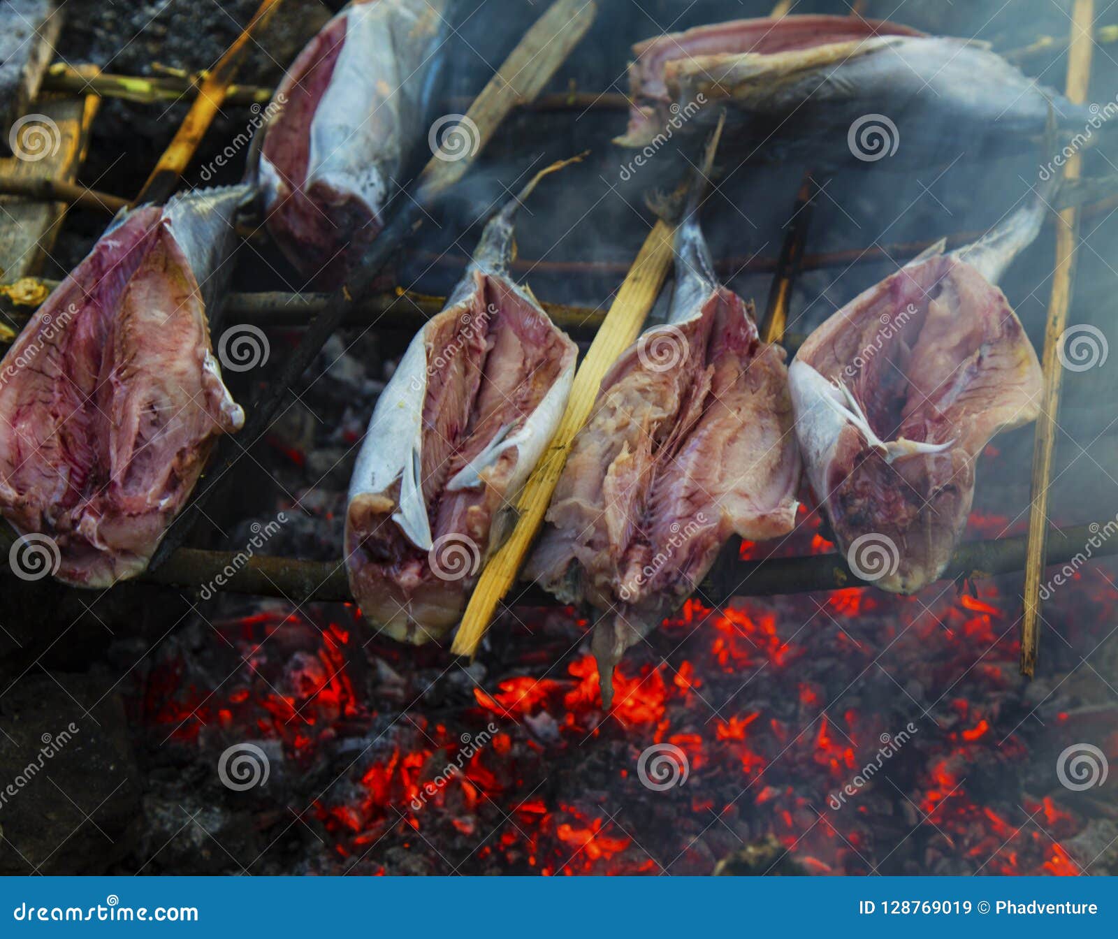 Roasting fish on fire stock image. Image of cook, diet - 128769019