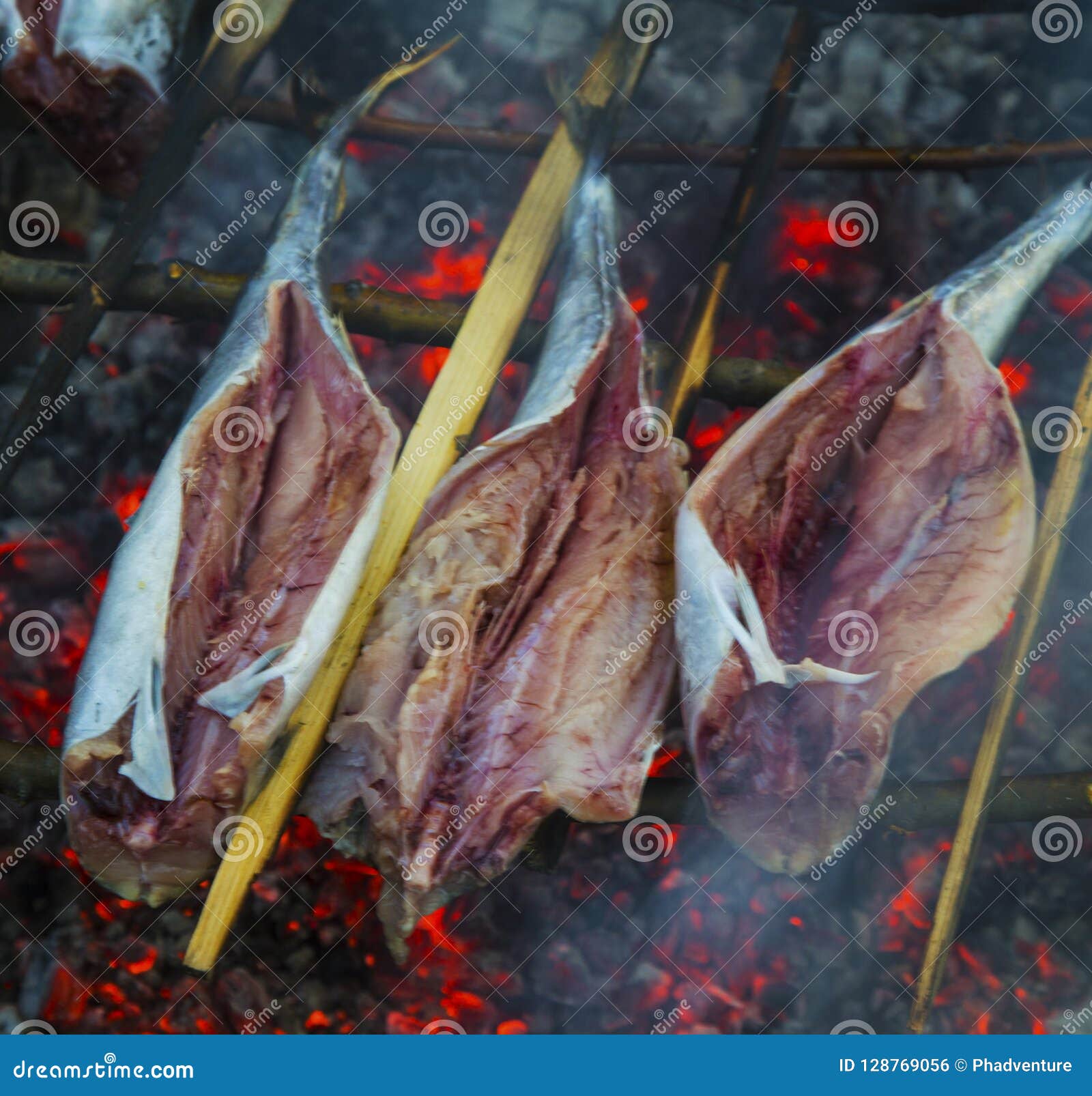Roasting fish on fire stock photo. Image of meat, dinner - 128769056