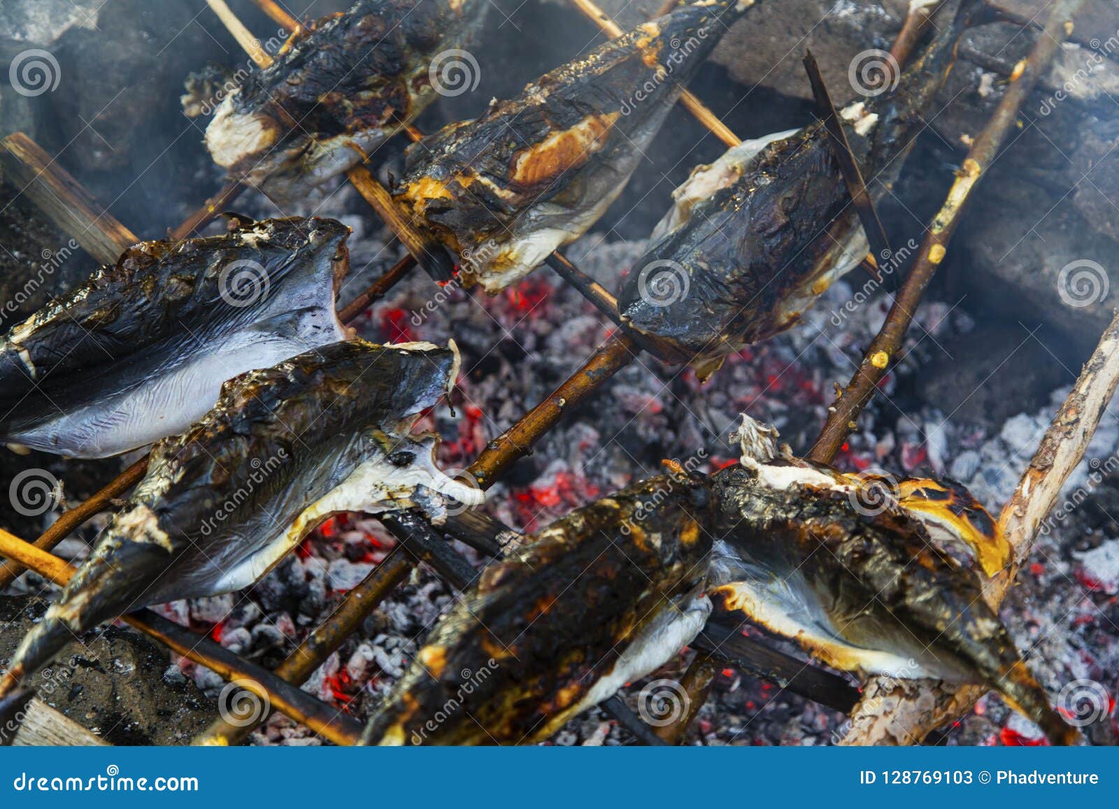 Roasting fish on fire stock image. Image of dinner, cuisine - 128769103