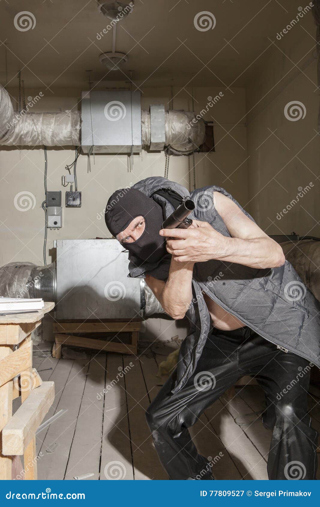 The Robber Armed with a Gun in the Attic Stock Image - Image of crime ...