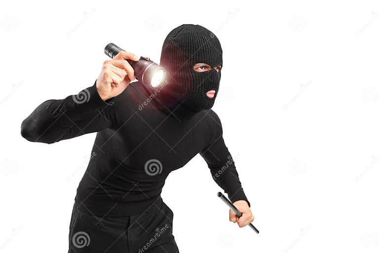 Robber Holding a Flashlight and Piece of Pipe Stock Photo - Image of ...