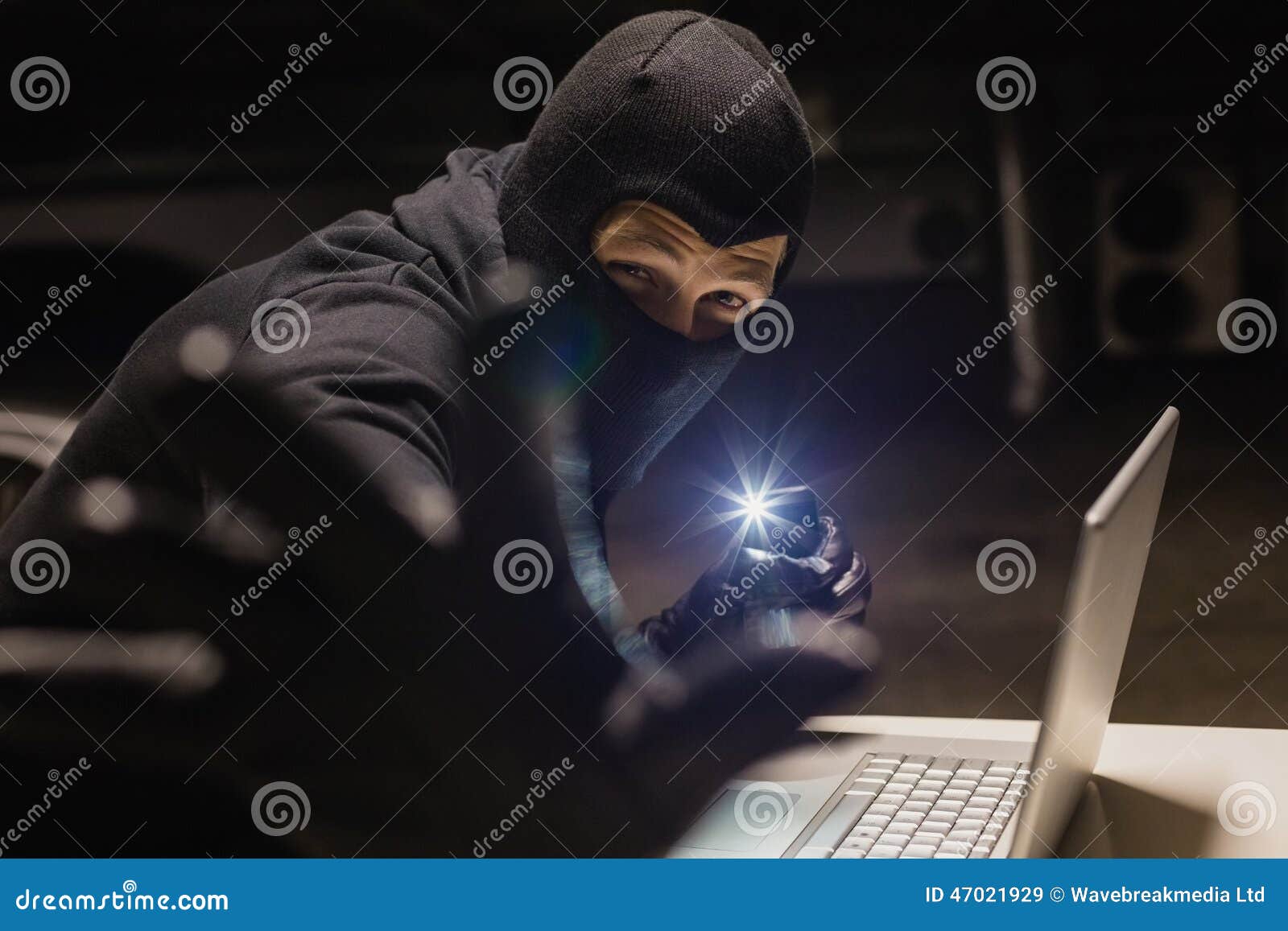 Robber Looking at Camera while Making Light with His Phone Stock Image ...