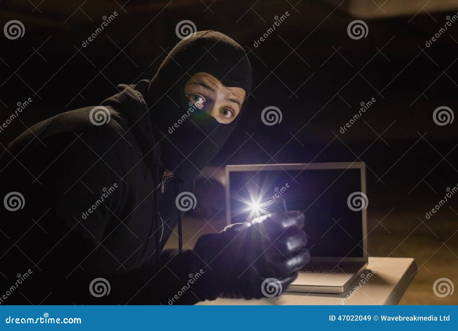 Robber Looking at Camera while Making Light with His Phone Stock Image ...