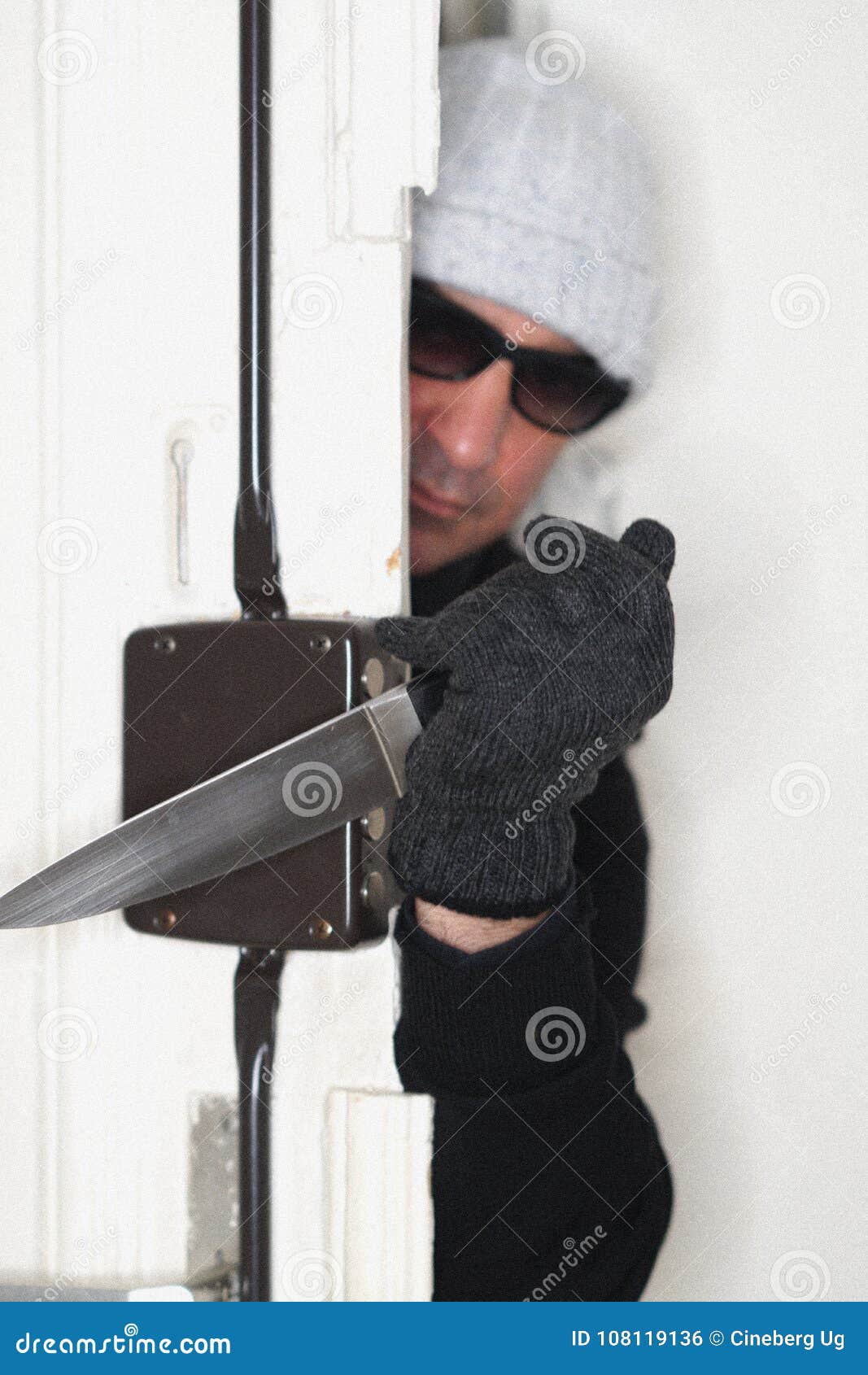 Robber Peeping Out of a Door Stock Photo - Image of burglary ...