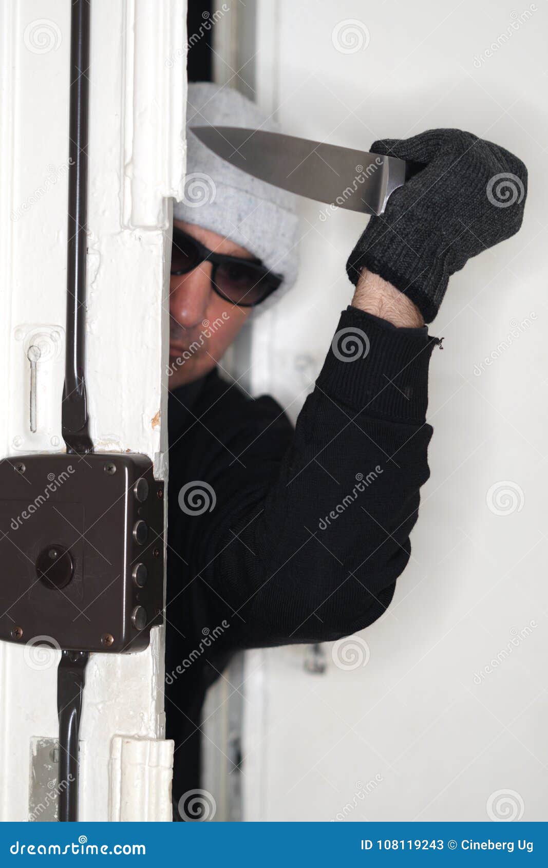 Robber Peeping Out of a Door Stock Image - Image of knife, lock: 108119243