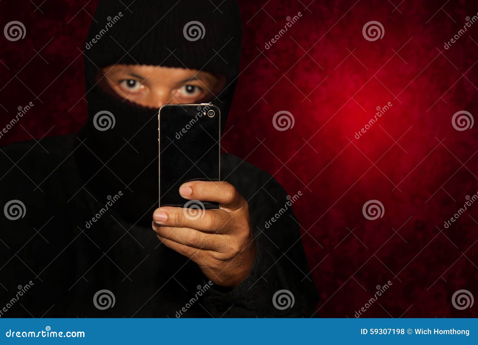 Robber with smartphone stock photo. Image of outlaw, commit - 59307198