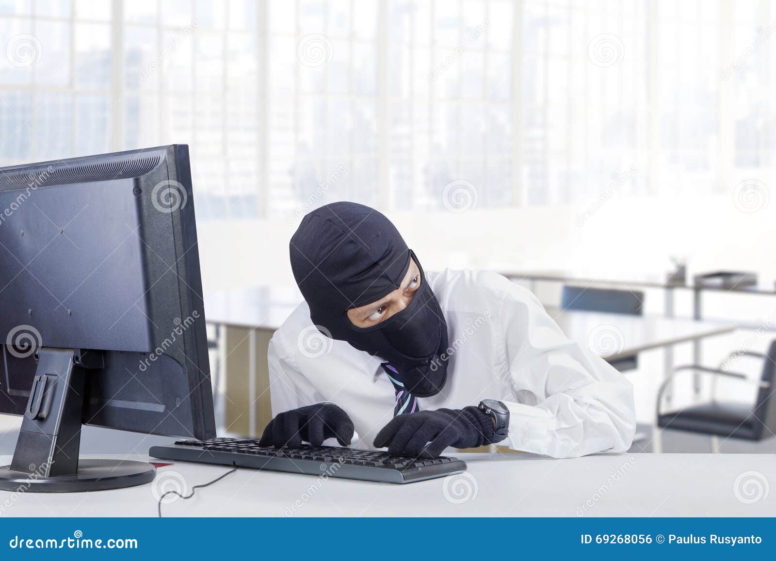 Robber Stealing Information at Workplace Stock Photo - Image of alert ...