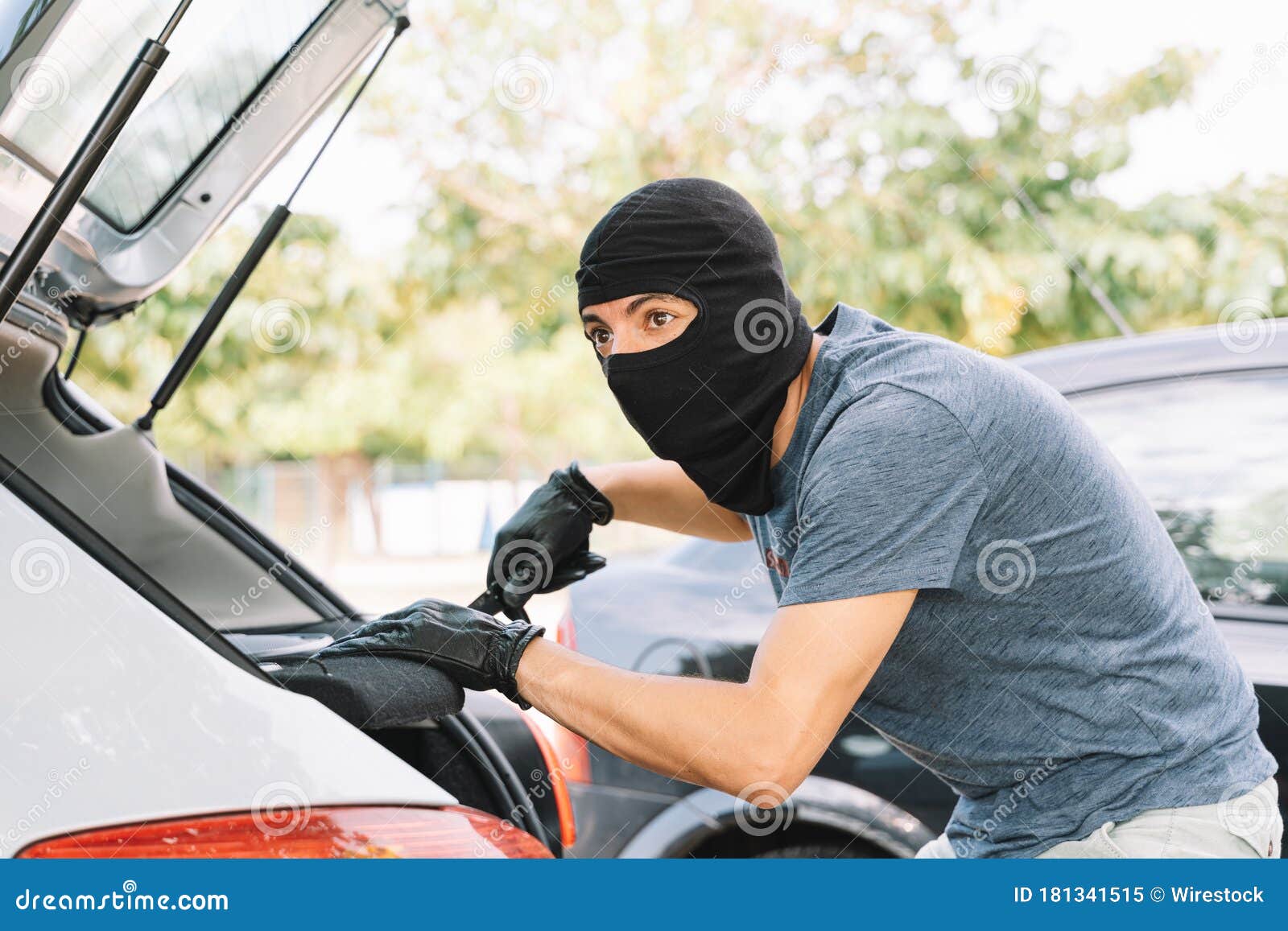 Robber Stealing Stuff from the Car while Looking Around Stock Image ...
