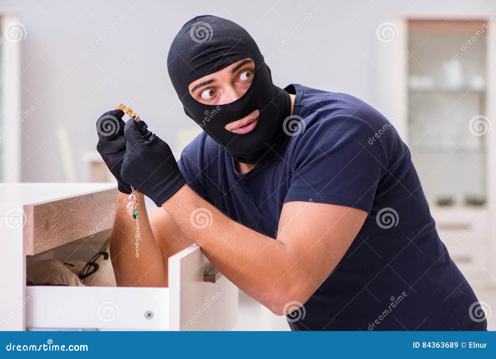 The Robber Wearing Balaclava Stealing Valuable Things Stock Image ...