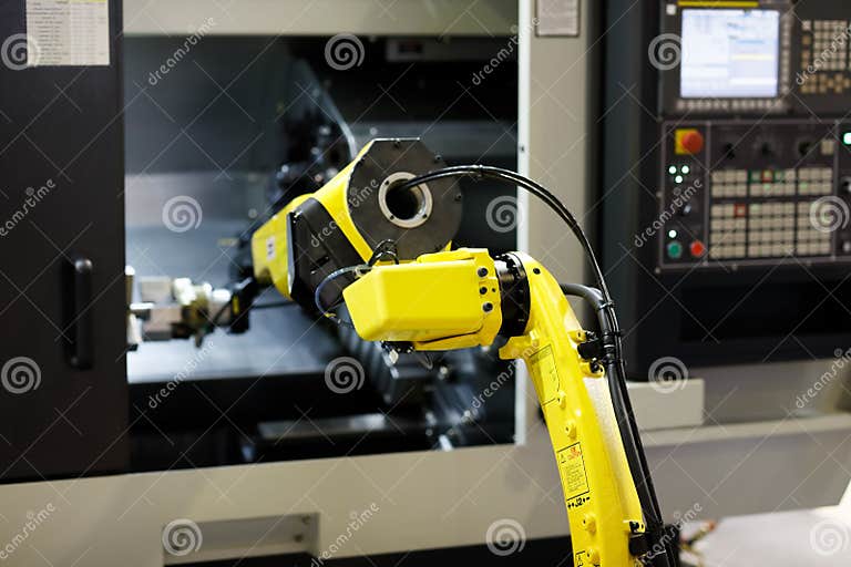 Robot Arm is Loading Detail into CNC Lathe Machine Stock Image - Image ...