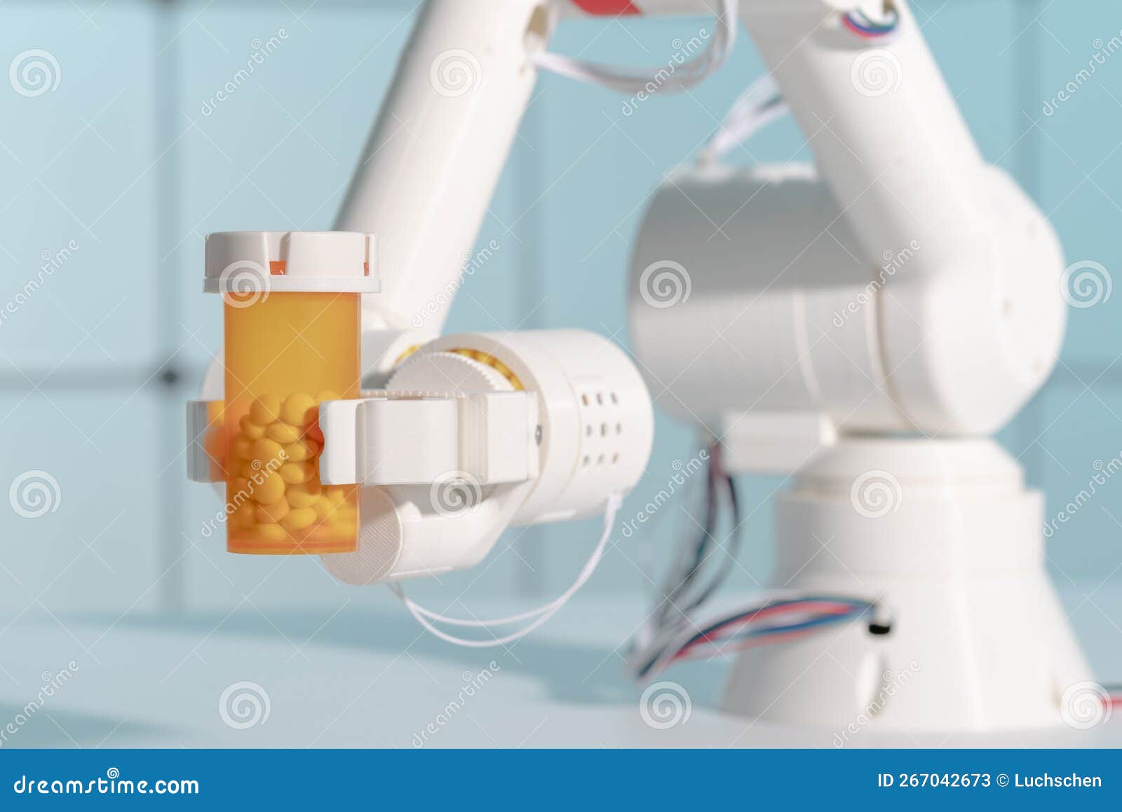 Robot Arm with a Pills in Bottle in the Laboratory. the Concept of ...