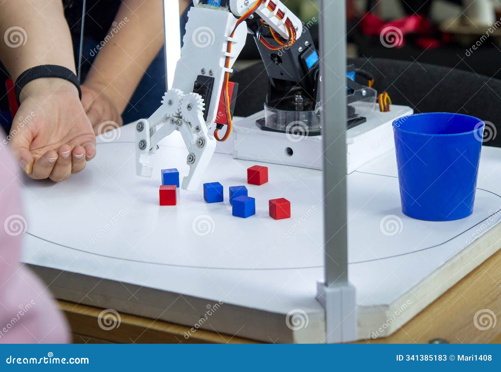 Robot Automatic Hand Taking Cubes and Putting in Glass. Automatic ...