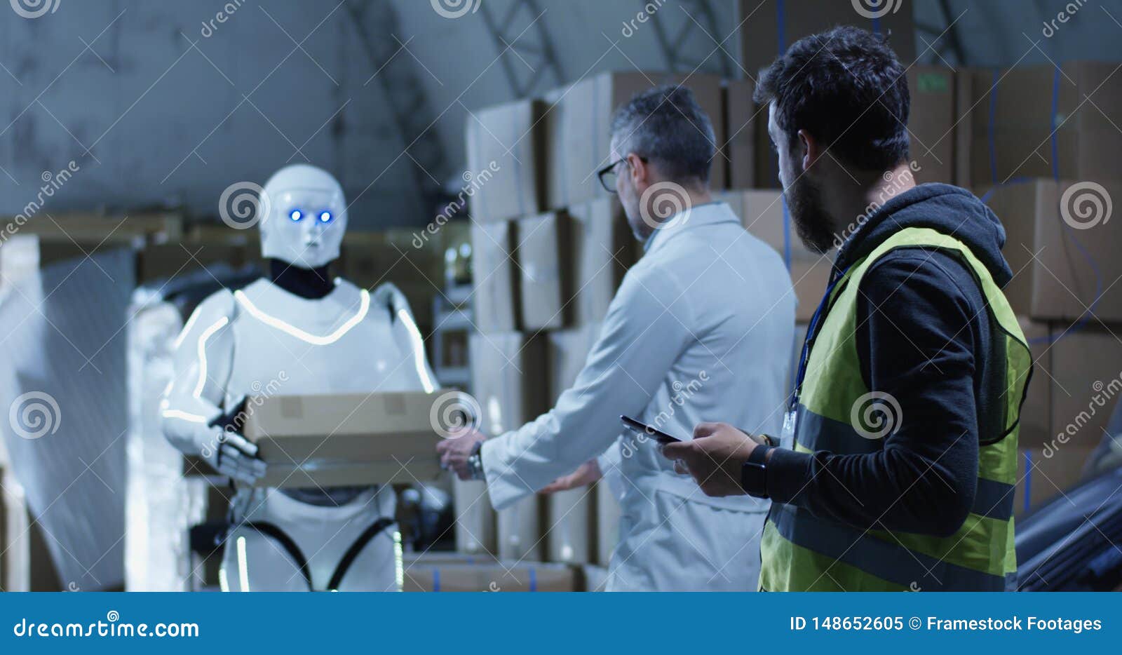 Robot Bringing Box To Technicians in a Warehouse Stock Image - Image of ...