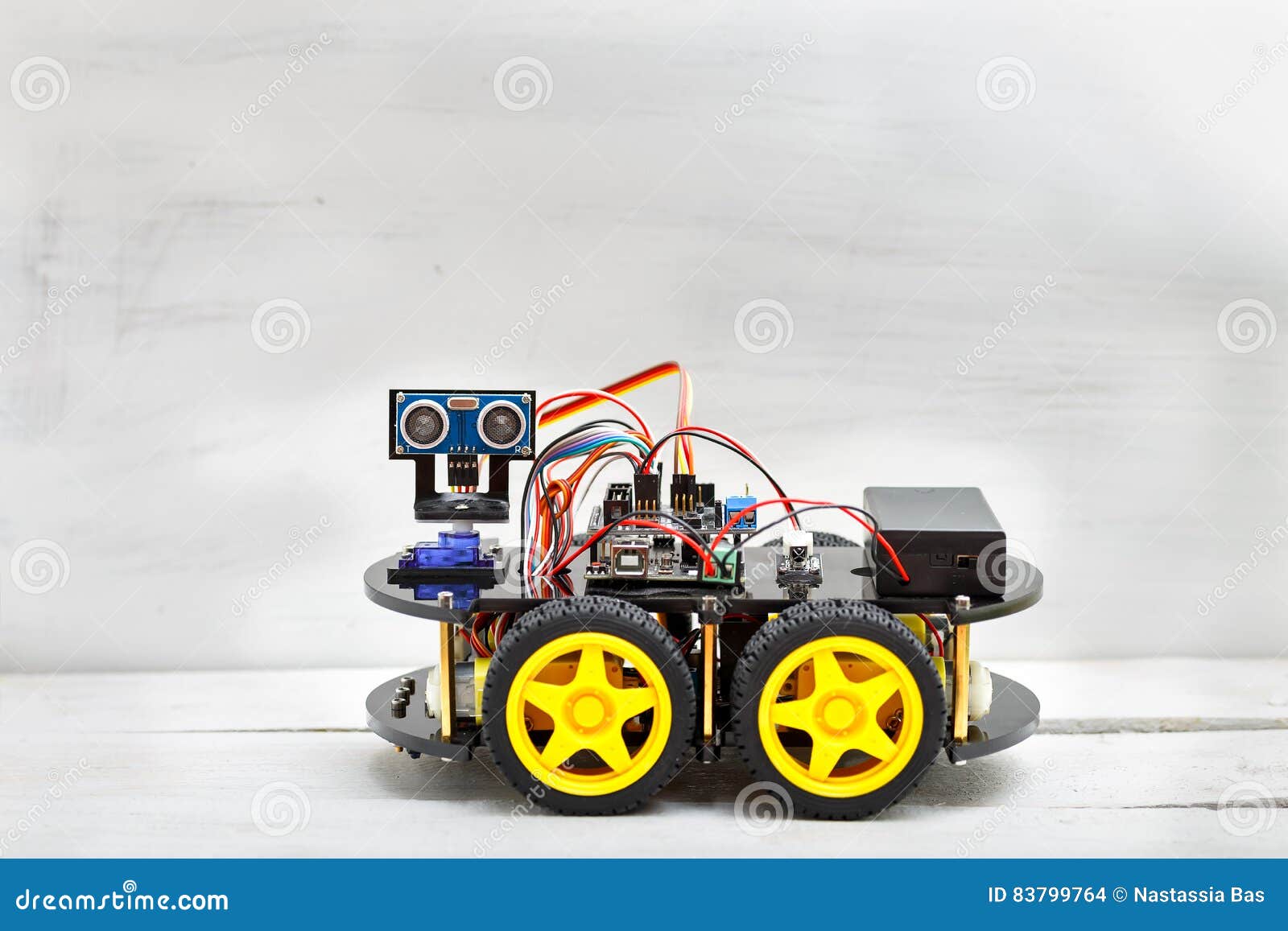 A Robot On Four Wheels On A White Background. Artificial Intelligence ...
