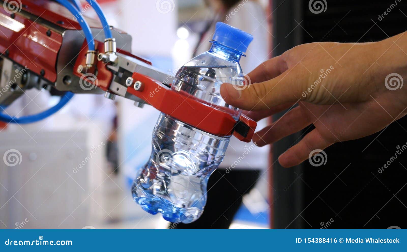 Robot Hand is Holding a Bottle of Water. Media. Technological Progress ...