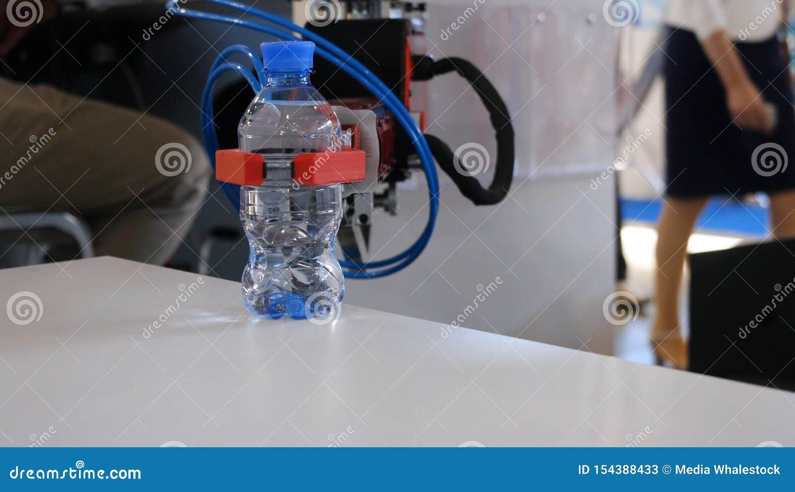 Robot Hand is Holding a Bottle of Water. Media. Technological Progress ...