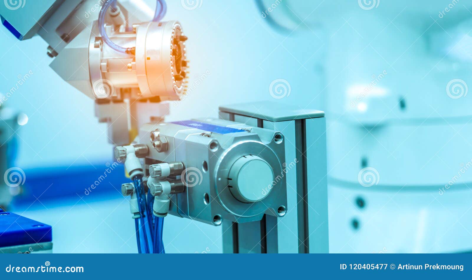 Robot Hand Machine Gripping Simulated Object on Blurred Background. Use ...