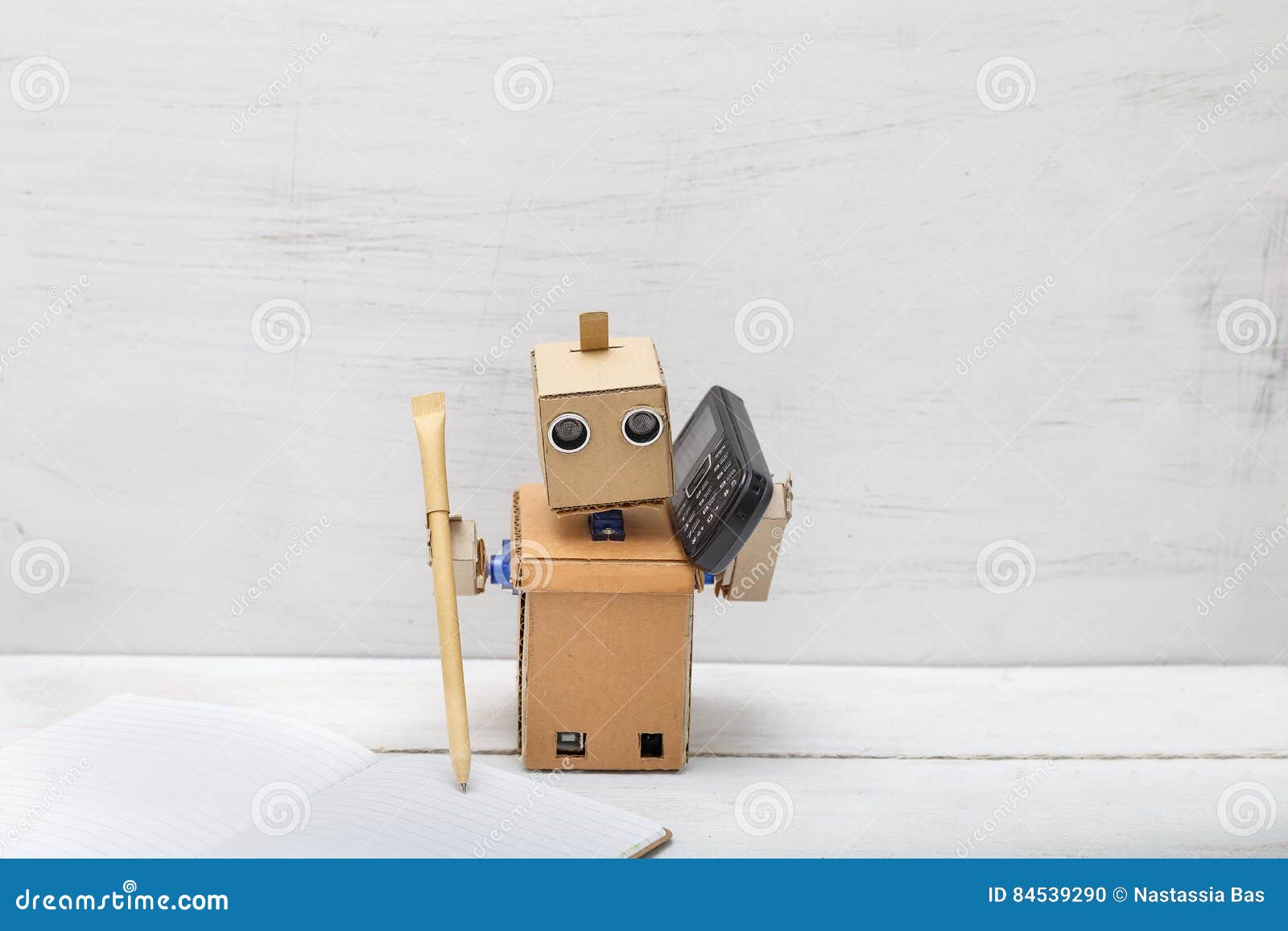 Robot Holding a Pen Writing in Diaries and Talking on the Phone. Stock ...