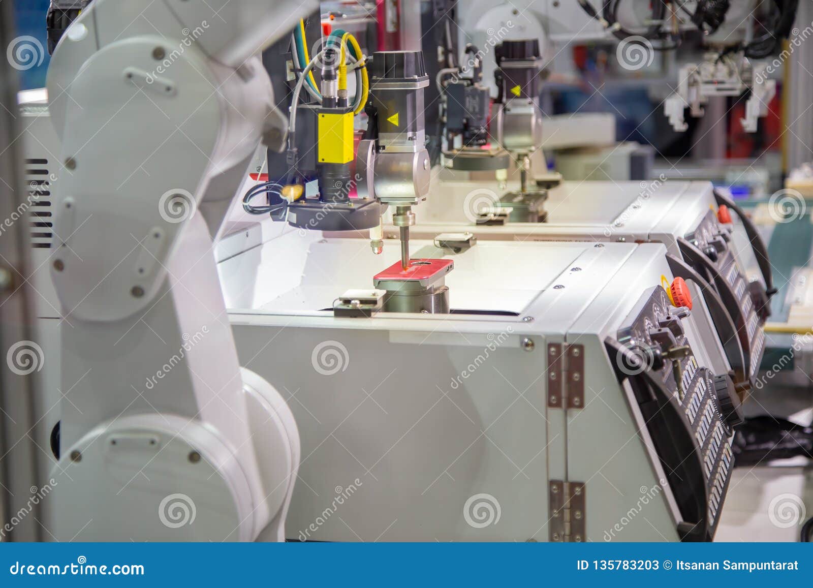 Robot Loading Mobile Phone Case To CNC Engraving Machine Stock Image ...