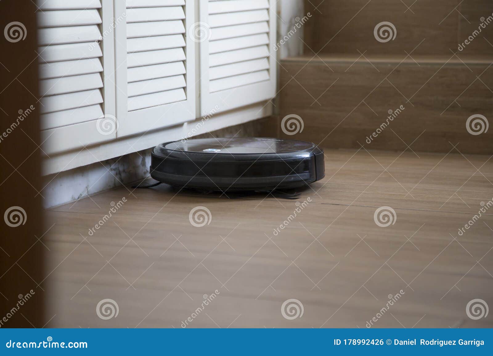 Robot sweeping the floor stock photo. Image of machine - 178992426
