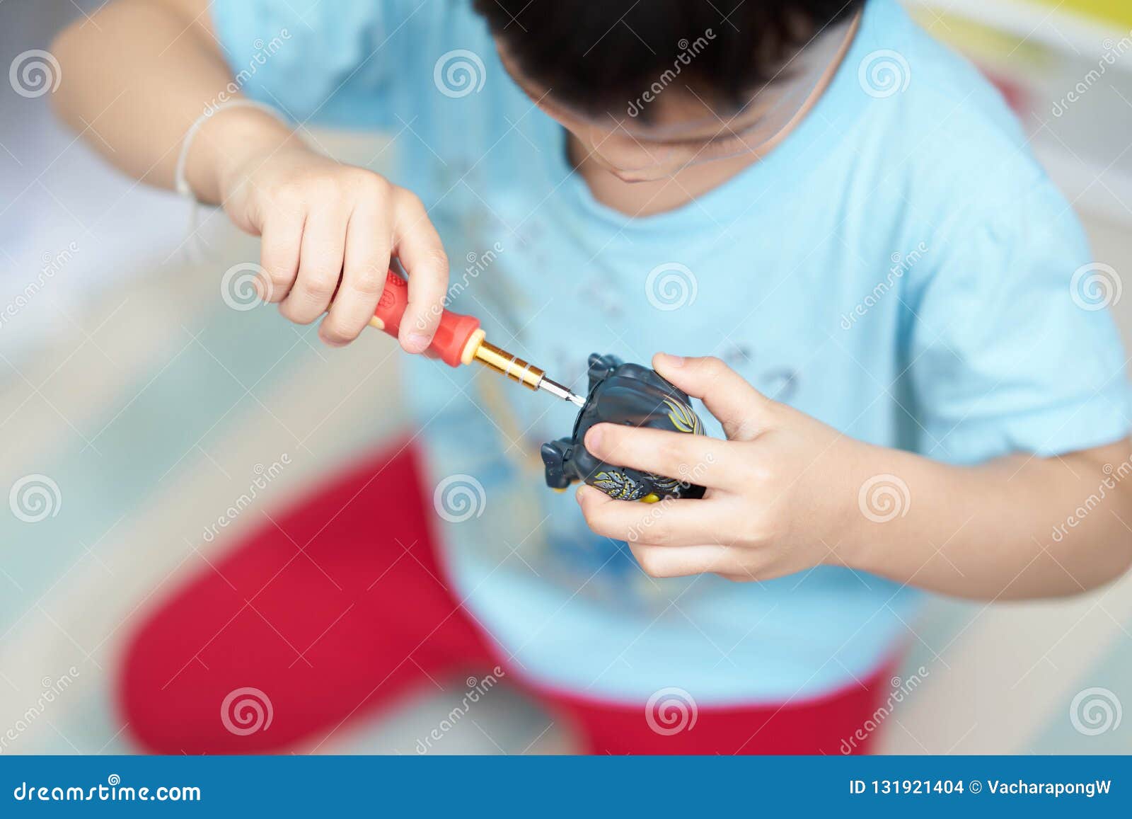 Robot toy fix by kid stock photo. Image of family, leisure - 131921404