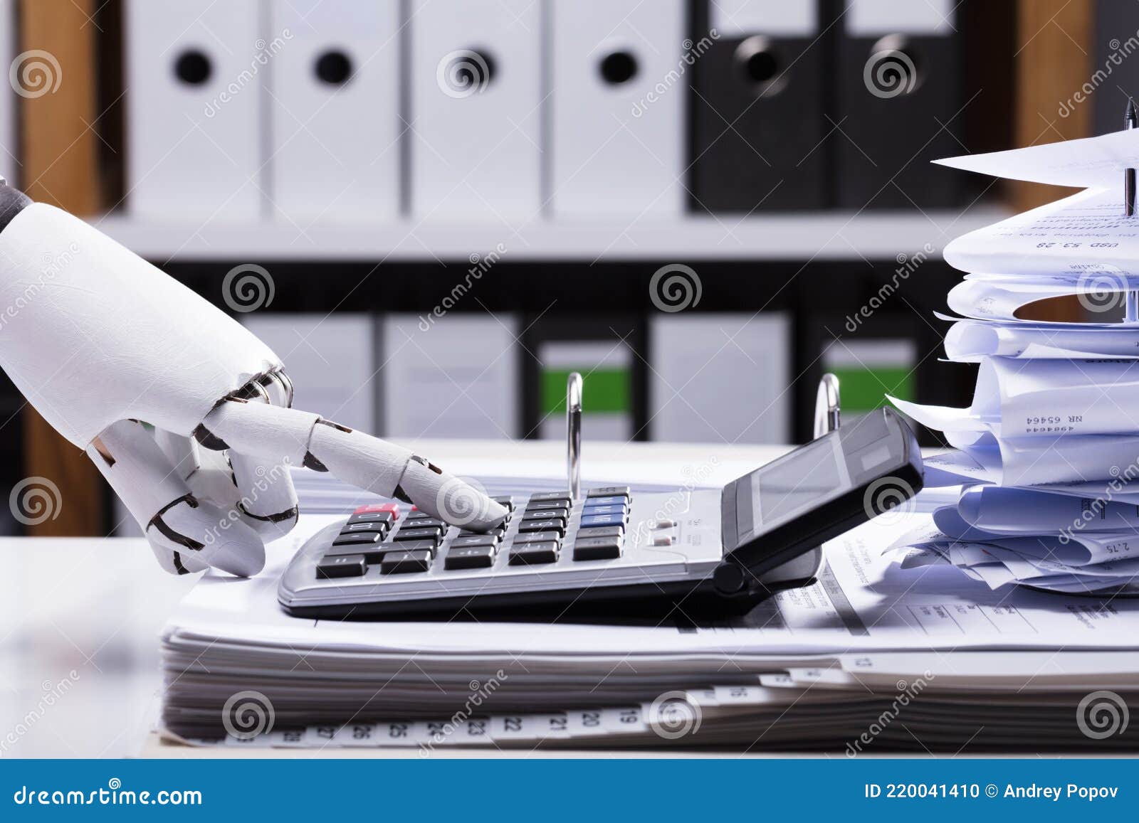 Robot Using Calculator stock photo. Image of budget - 220041410